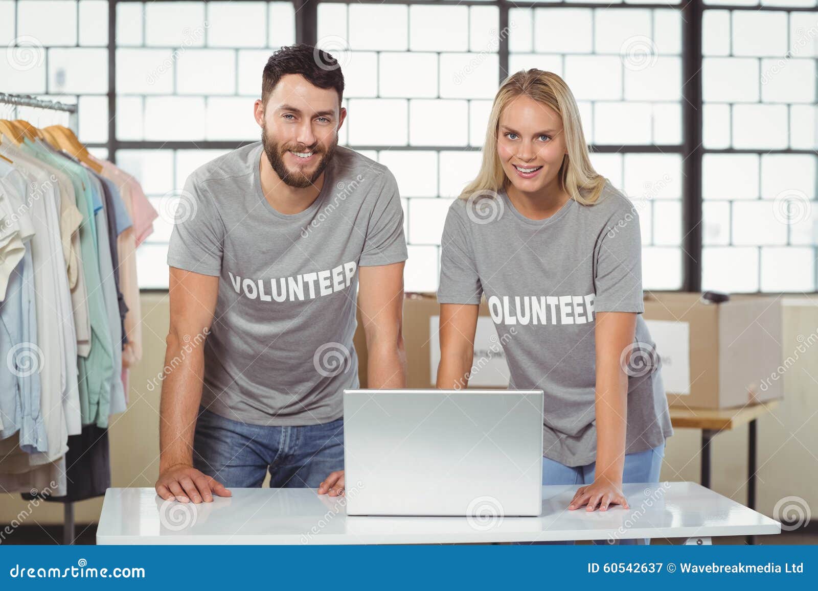 Portrait of Smiling Volunteers Working on Laptop Stock Image - Image of ...
