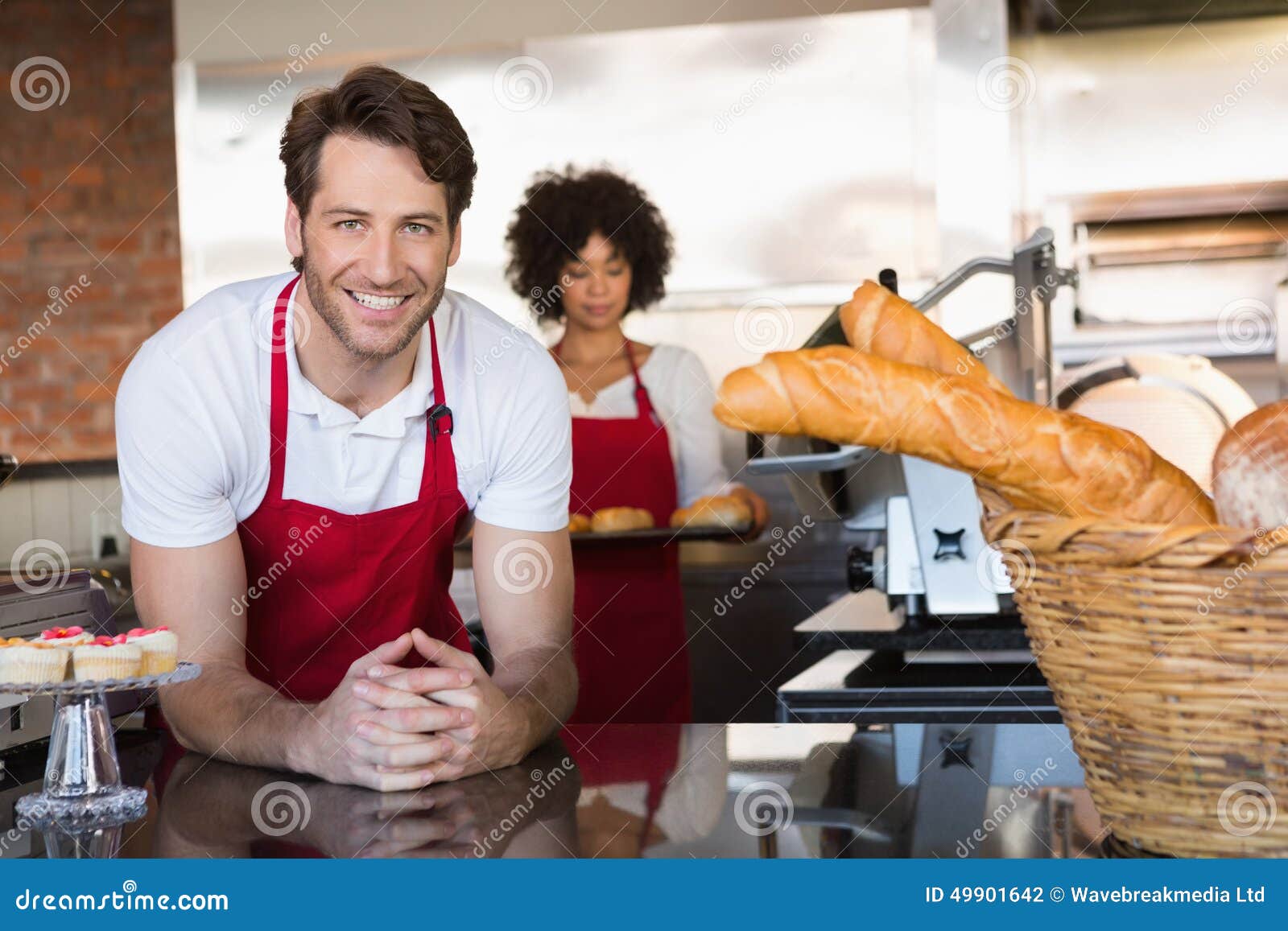 Portrait of Smiling Waiter in Front of His Colleague Stock Photo ...