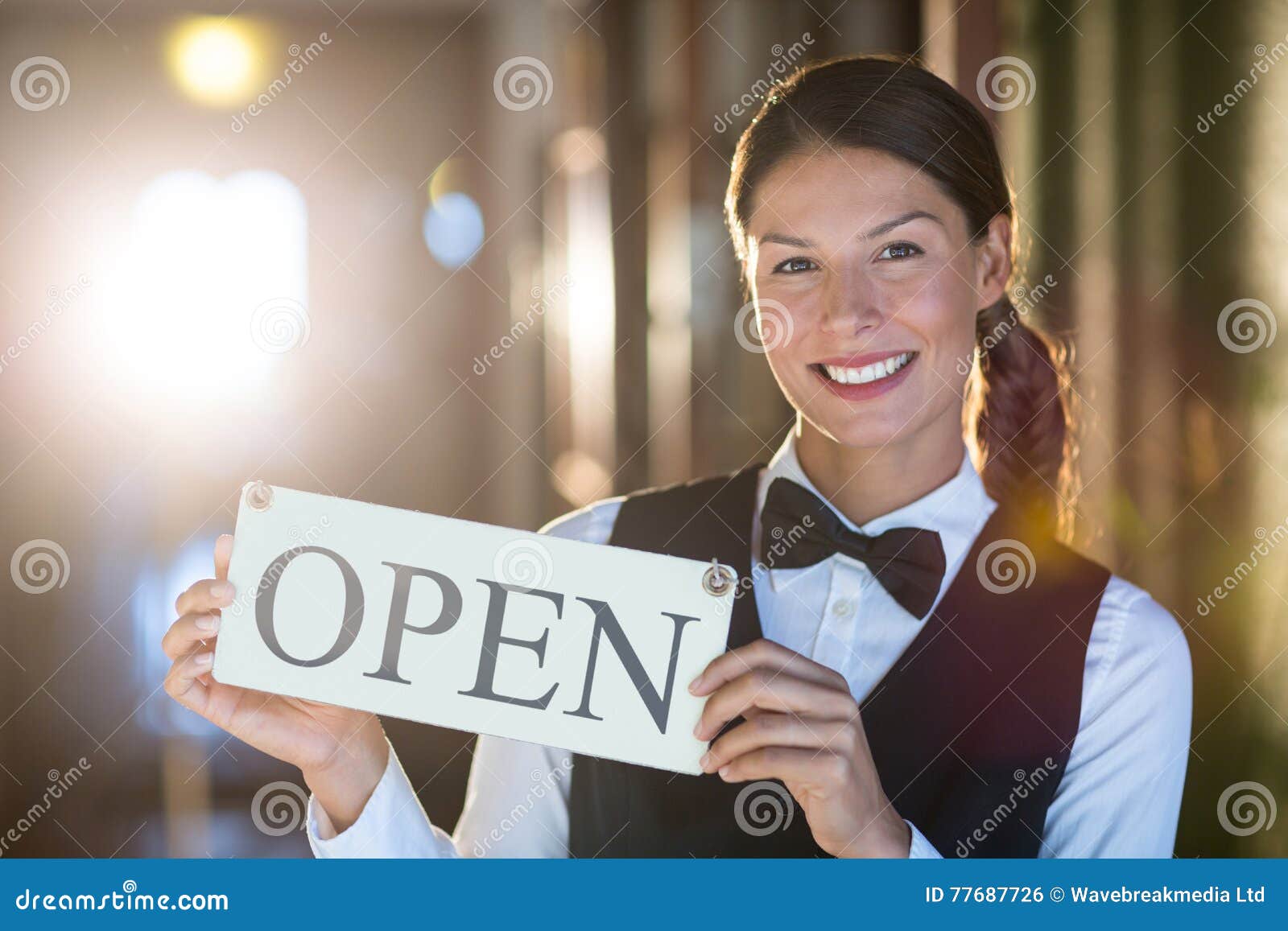 Portrait of Smiling Waitress Holding Open Sign Stock Photo - Image of ...