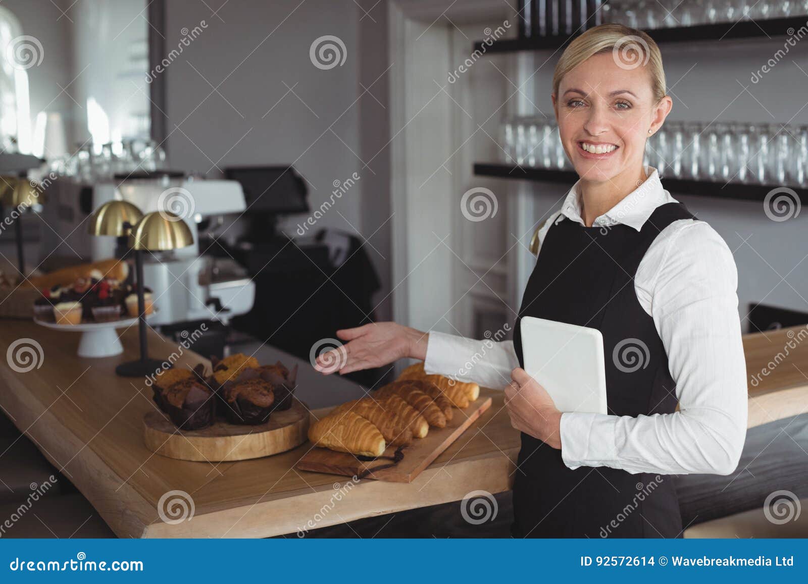 Portrait of Smiling Waitress Standing at Counter Stock Photo - Image of ...