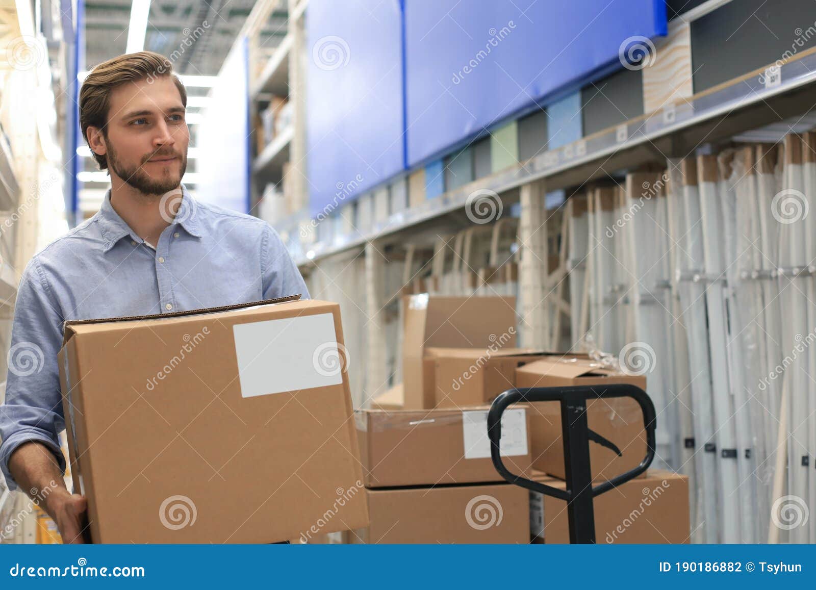 Portrait of a Smiling Warehouse Keeper at Work Stock Photo - Image of ...