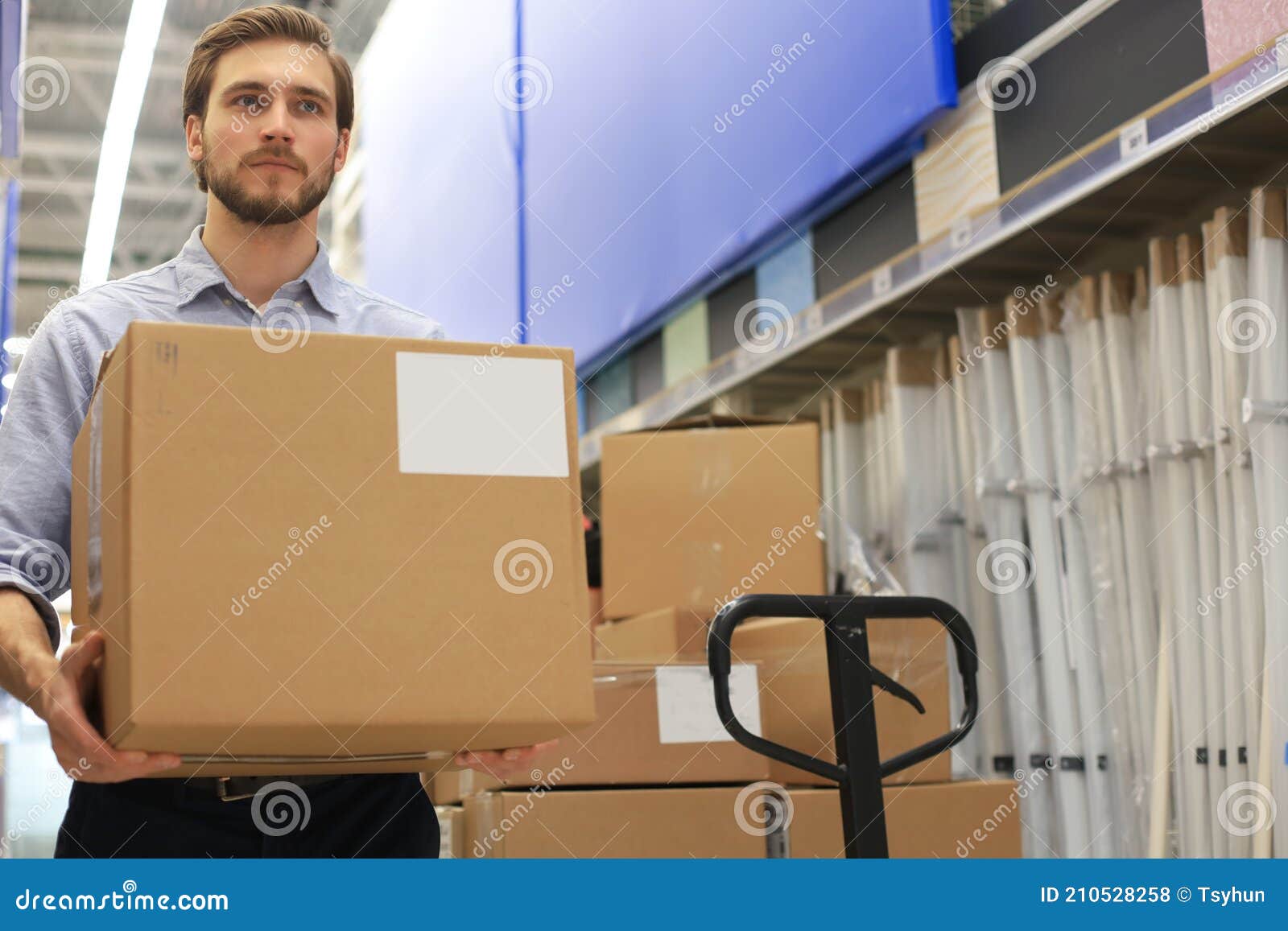 Portrait of a Smiling Warehouse Keeper at Work Stock Photo - Image of ...
