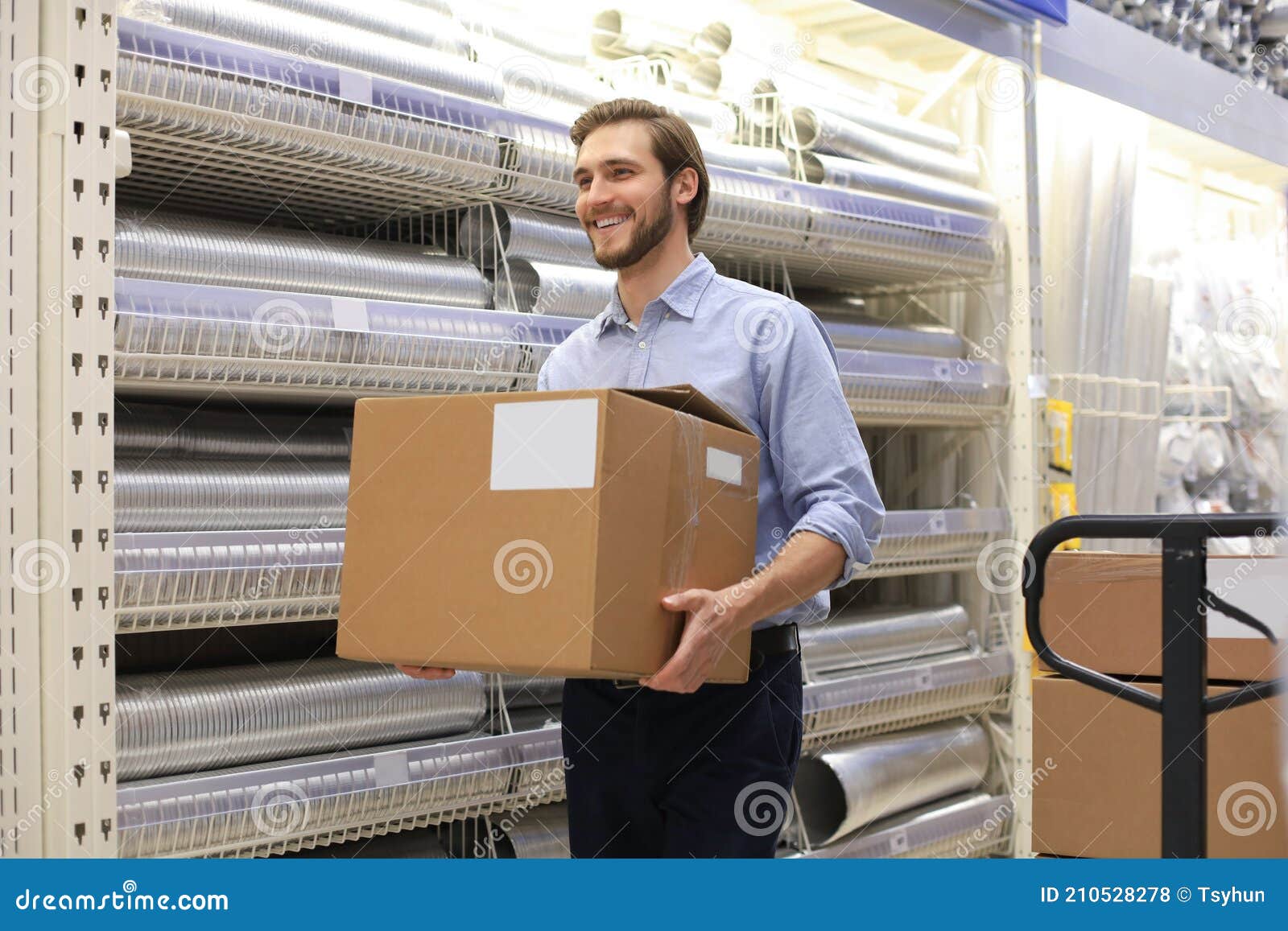 Portrait of a Smiling Warehouse Keeper at Work Stock Photo - Image of ...