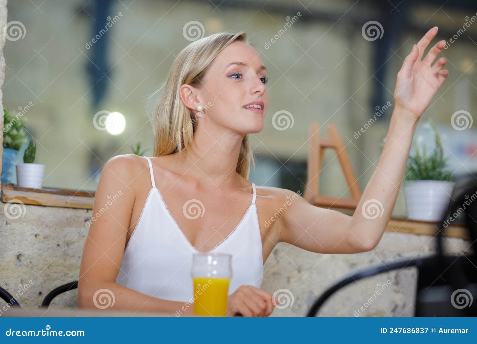 Portrait Smiling Woman Calling for Waiter in Restaurant Stock Image ...