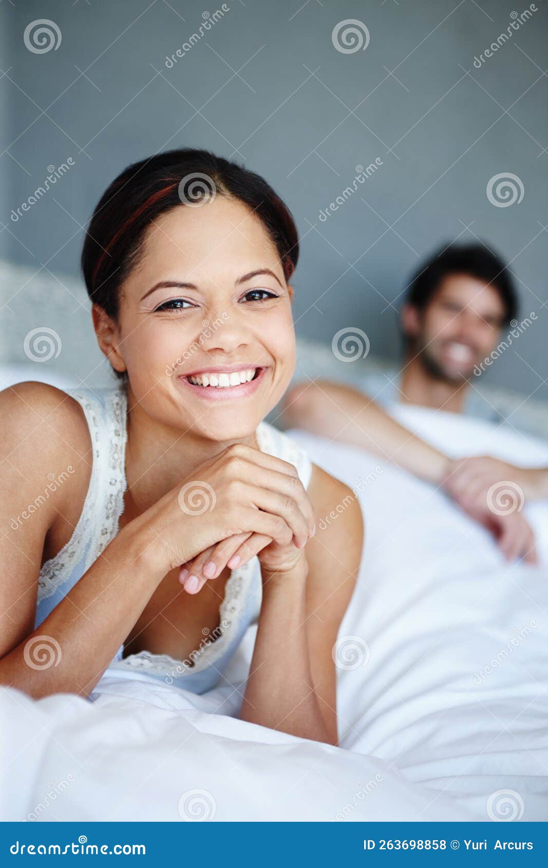 I Love Lying In Portrait Of A Smiling Woman Lying On Her Bed With Her