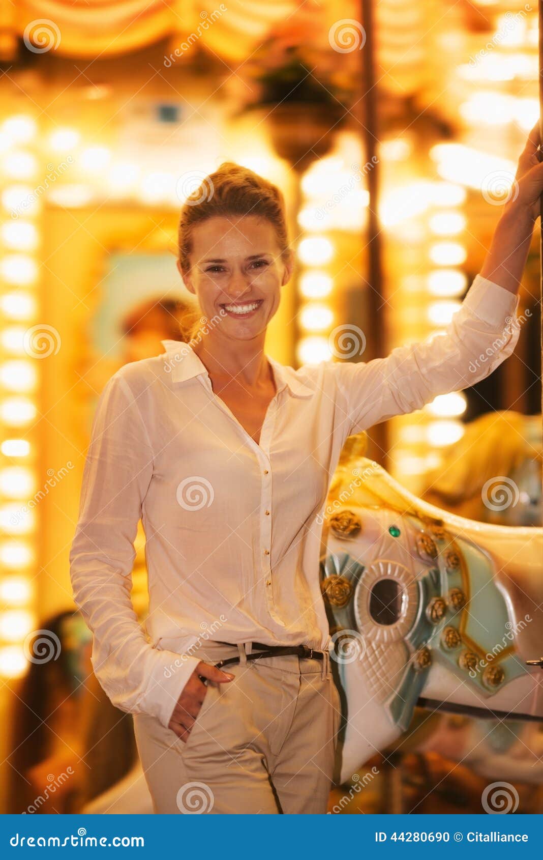 Portrait of Smiling Woman Riding on Carousel Stock Photo - Image of ...