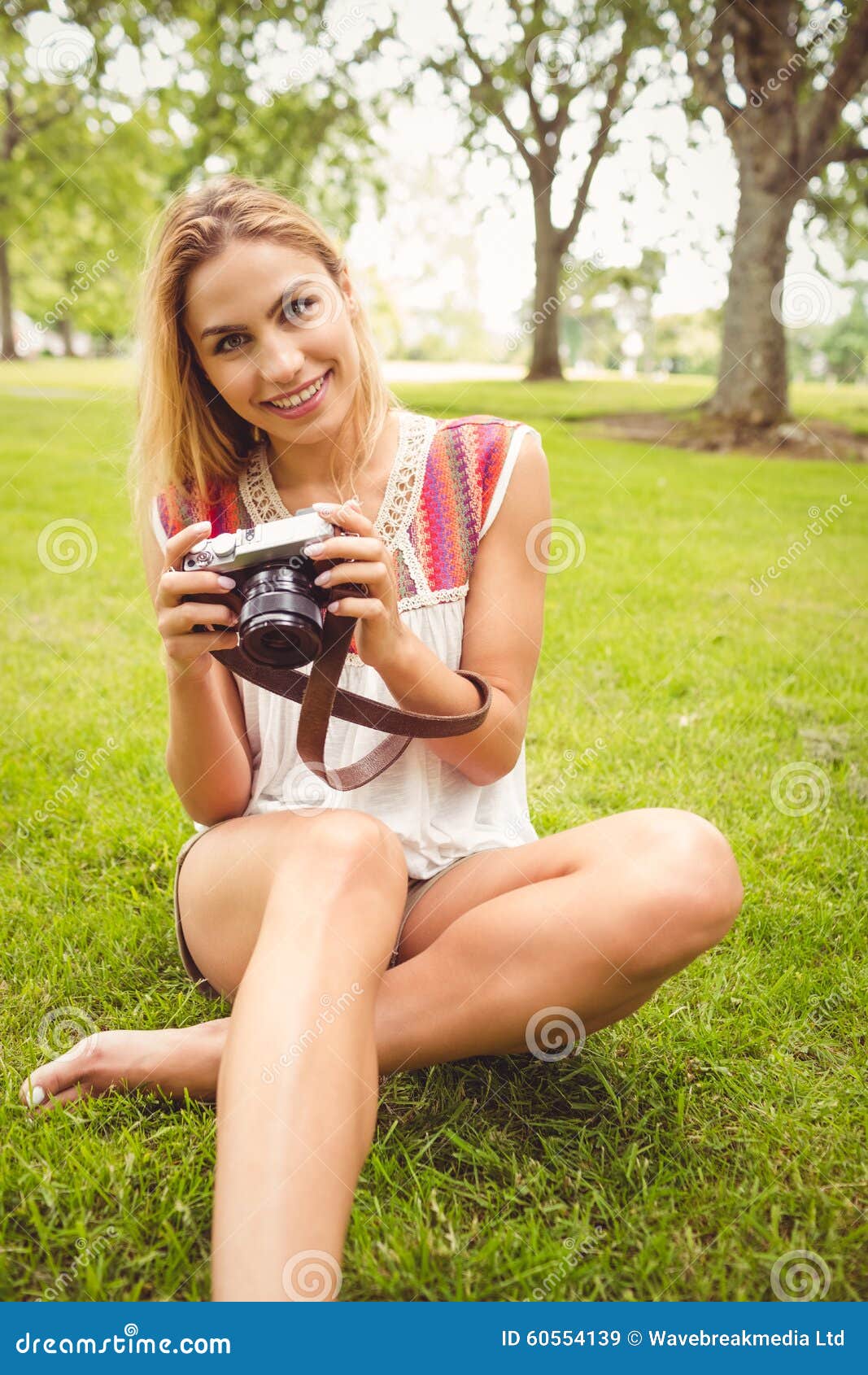 Portrait Of Smiling Woman Sitting On Grass Stock Image Image Of Green