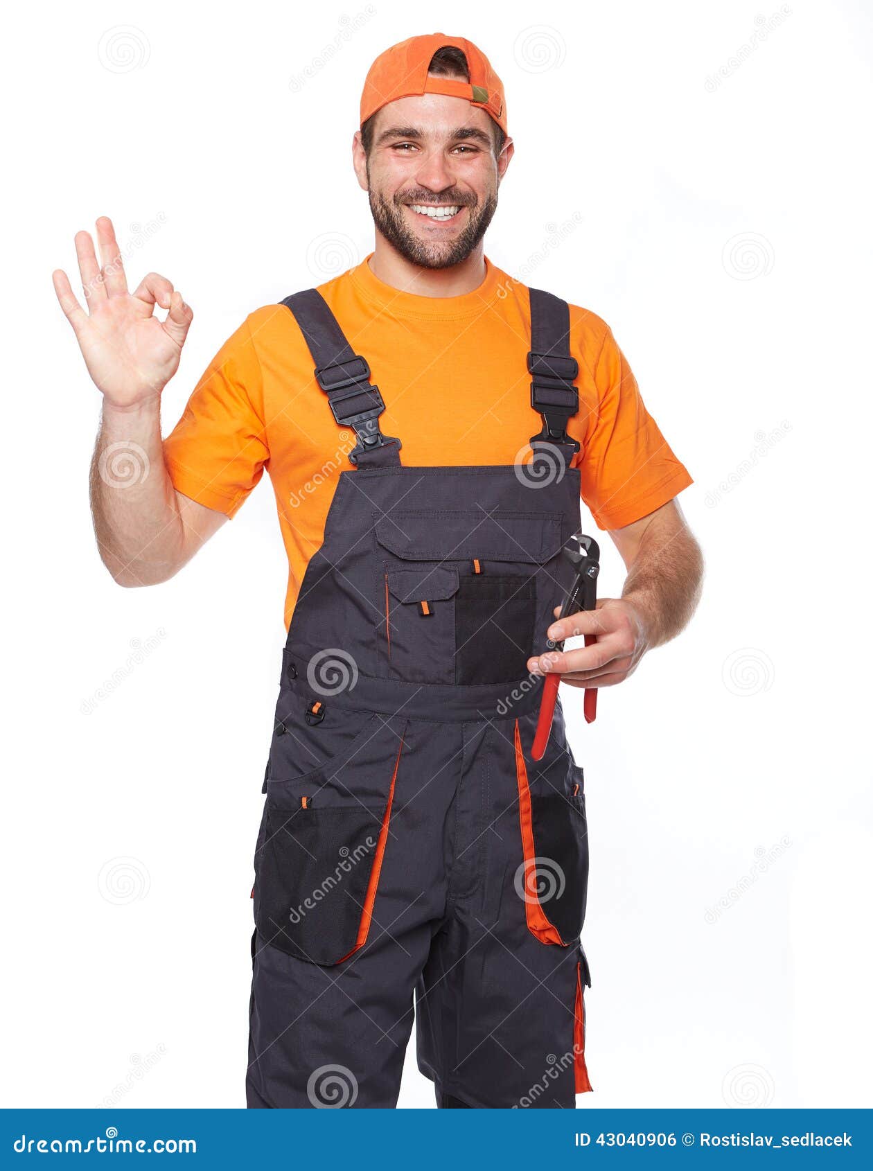 Portrait of a Smiling Worker in Blue Uniform Holding Pliers Stock Photo ...