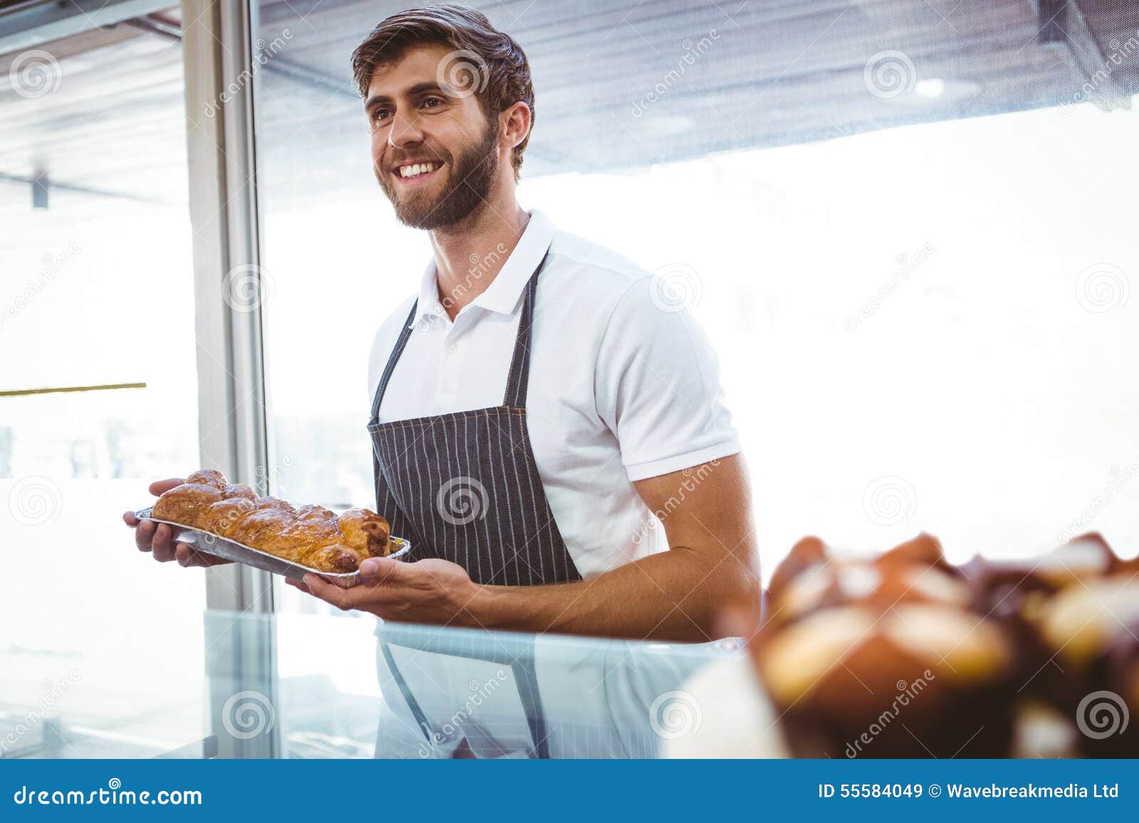 Portrait of Smiling Worker Showing Basket of Bread Stock Image - Image ...