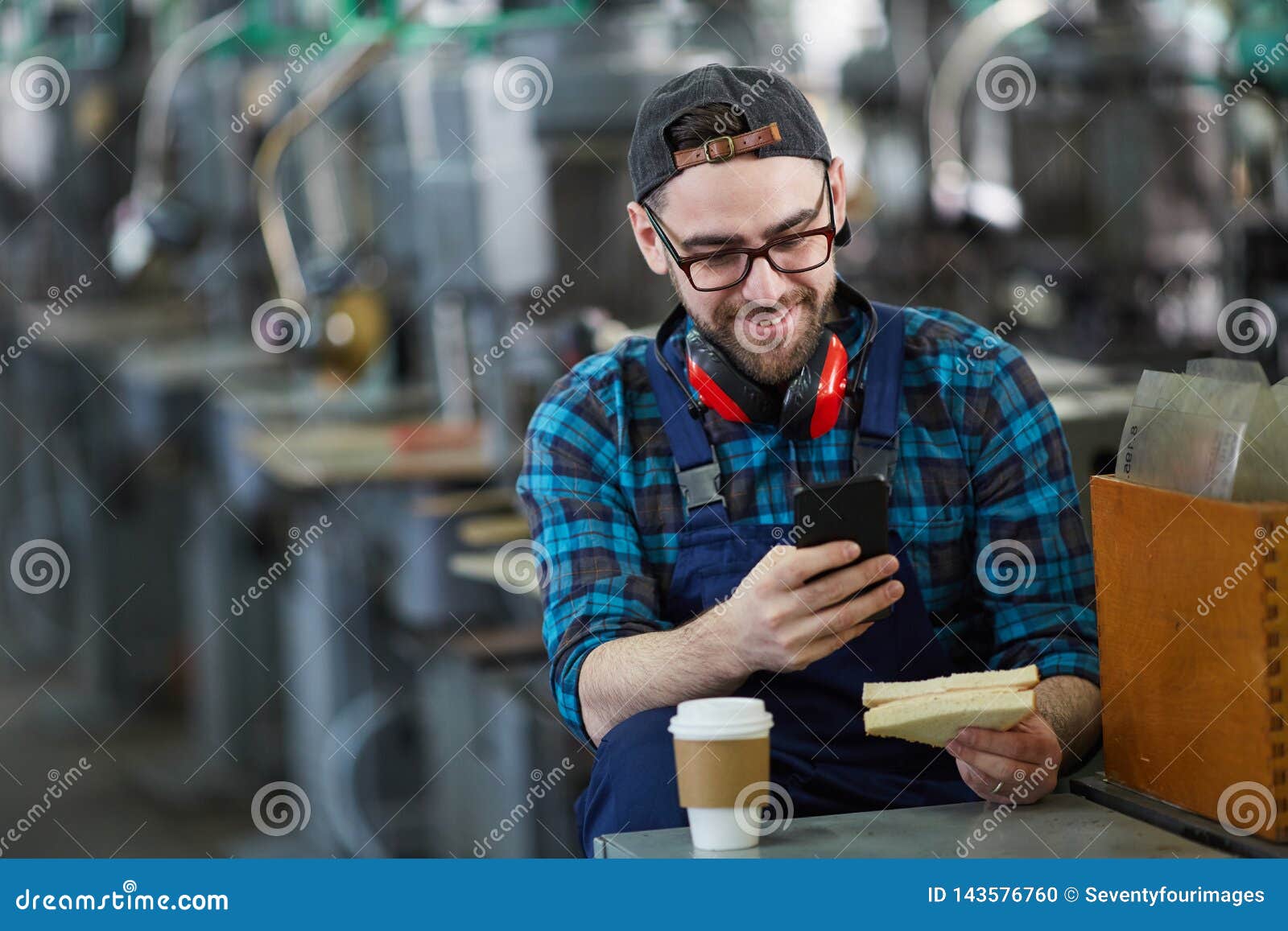 Worker Using Smartphone on Break Stock Photo - Image of engineer, break ...