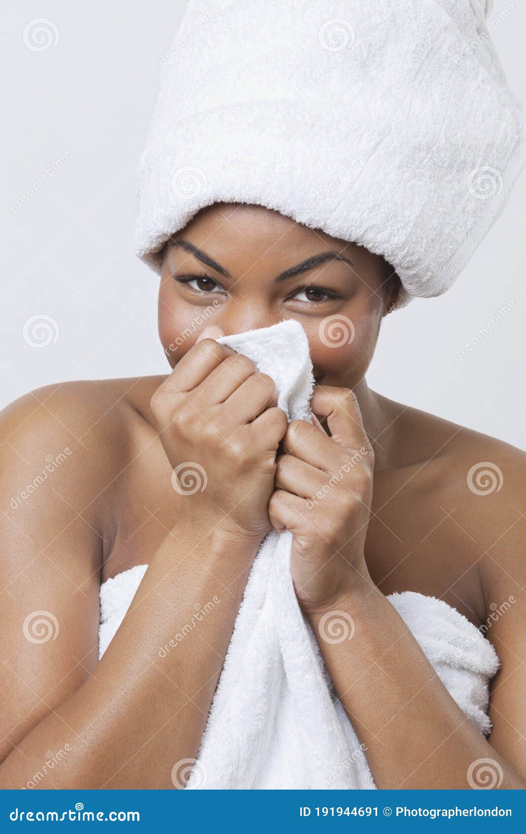 Portrait Of Smiling Young African American Woman Wrapped In Towel Over ... Portrait Of Smiling Young African American Woman Wrapped In Towel Over ...