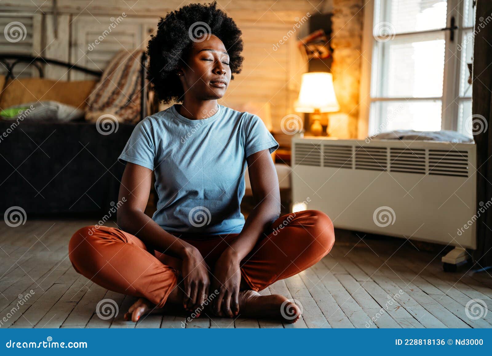 Portrait of a Smiling Young Black Woman Sitting on Floor Practicing ... Portrait of a Smiling Young Black Woman Sitting on Floor Practicing ...