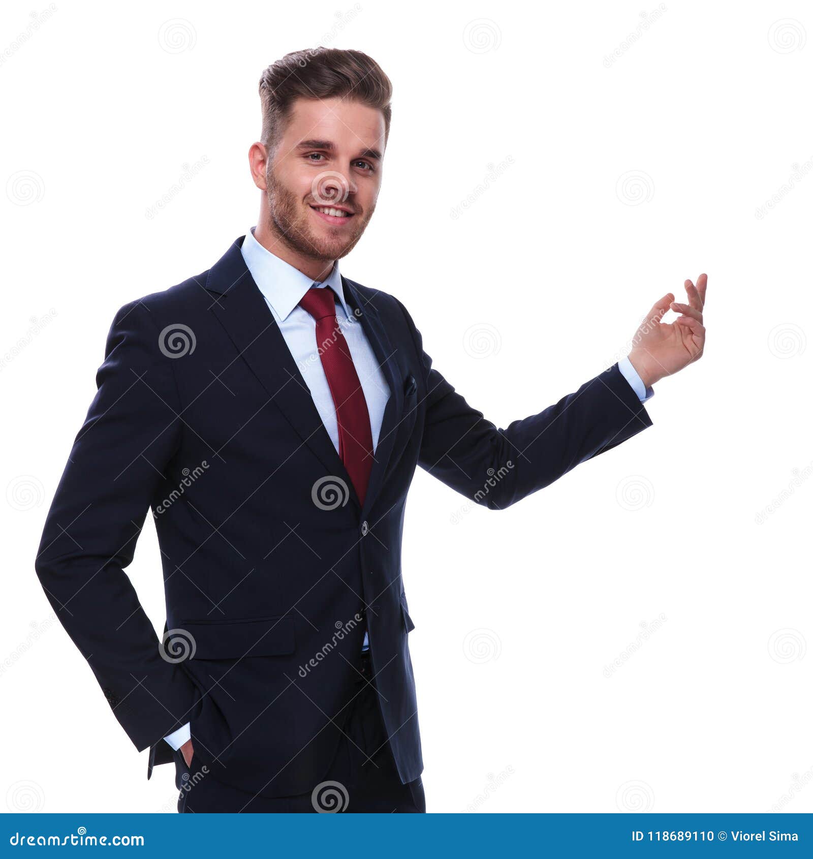 Portrait of Smiling Young Businessman Presenting To Side Stock Photo ... Portrait of Smiling Young Businessman Presenting To Side Stock Photo ...