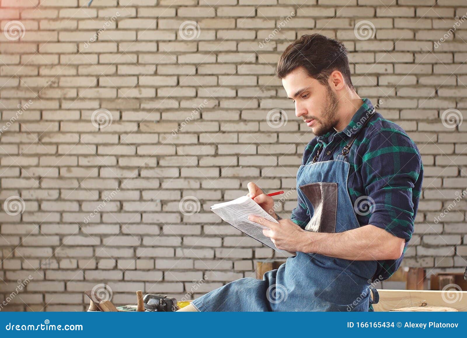 Portrait of Smiling Young Carpenter in Interior of Workshop with ...