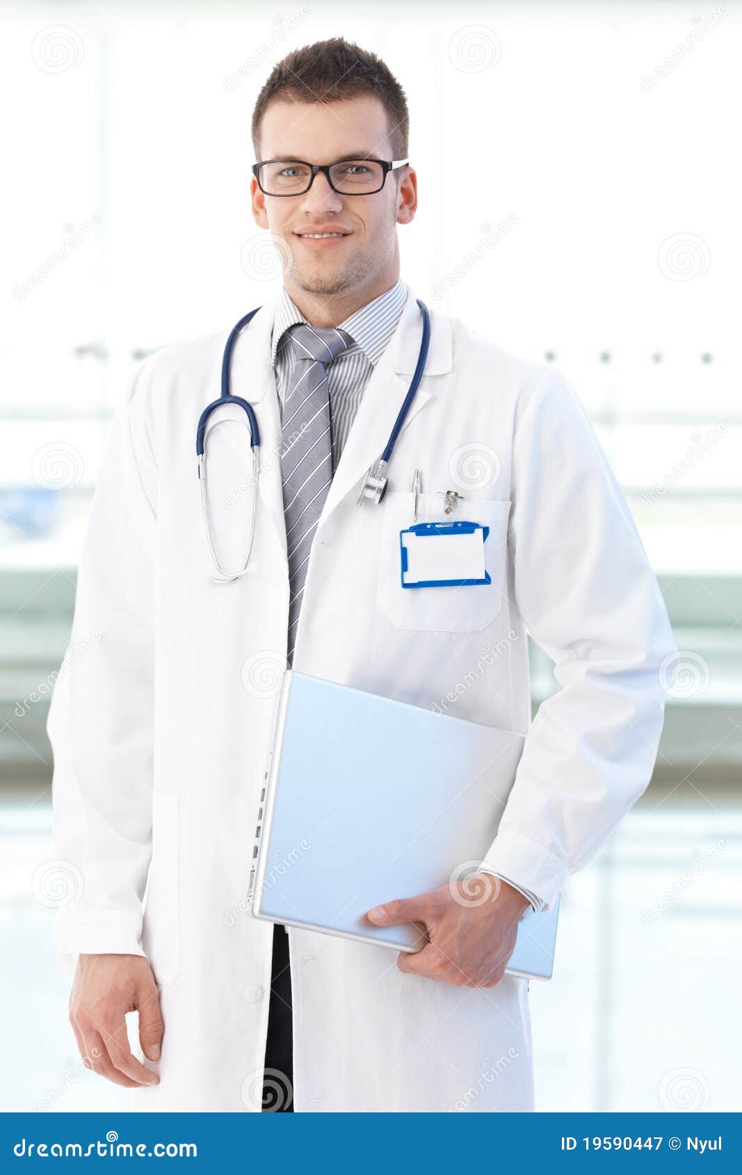 Portrait of Smiling Young Doctor Standing Stock Image - Image of ...