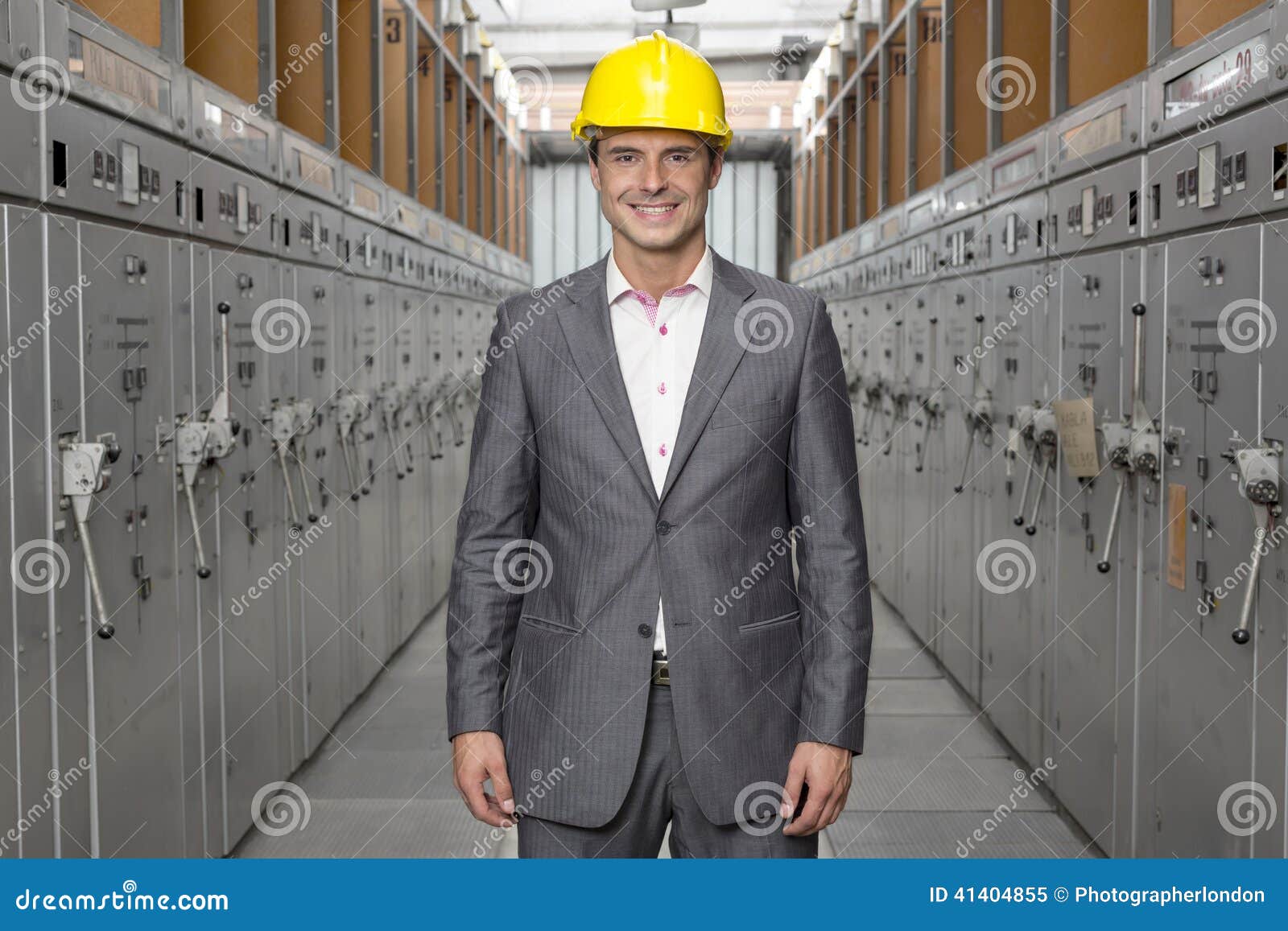 Portrait of Smiling Young Male Supervisor Standing in Control Room ...