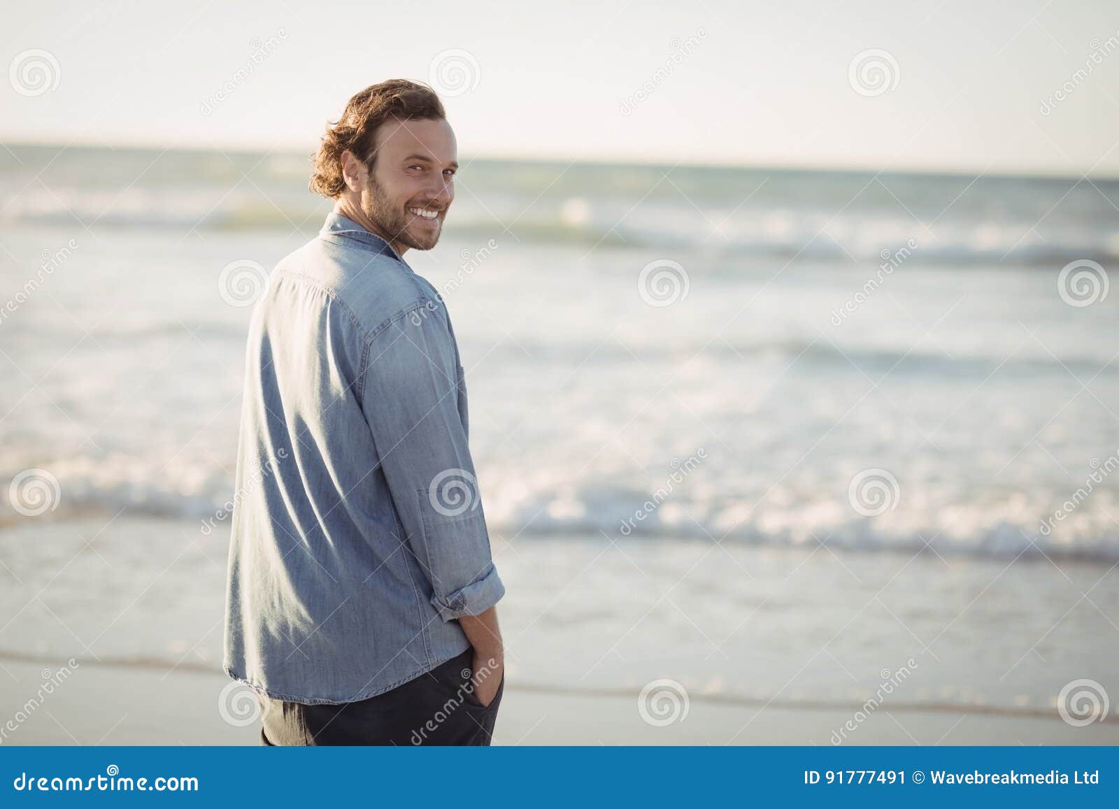 Portrait of Smiling Young Man Beach Stock Image - Image of quarter ...
