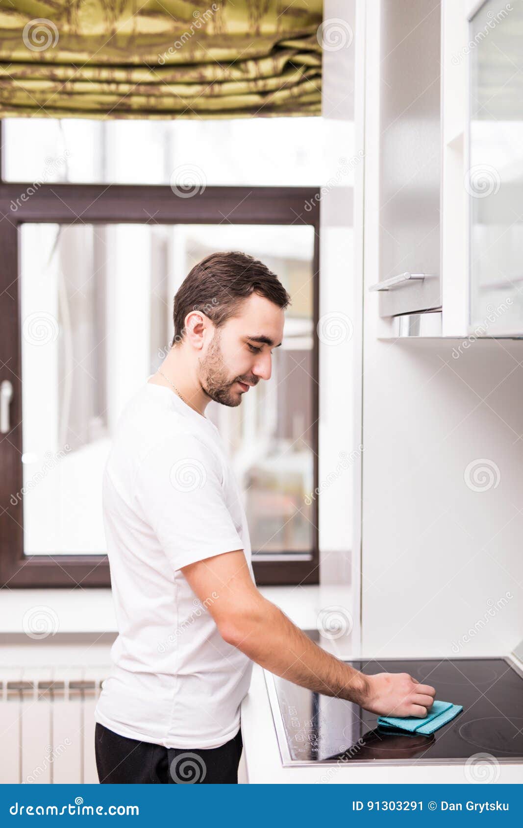 Portrait of Smiling Young Man Cleaning Kitchen in the House Stock Image ...
