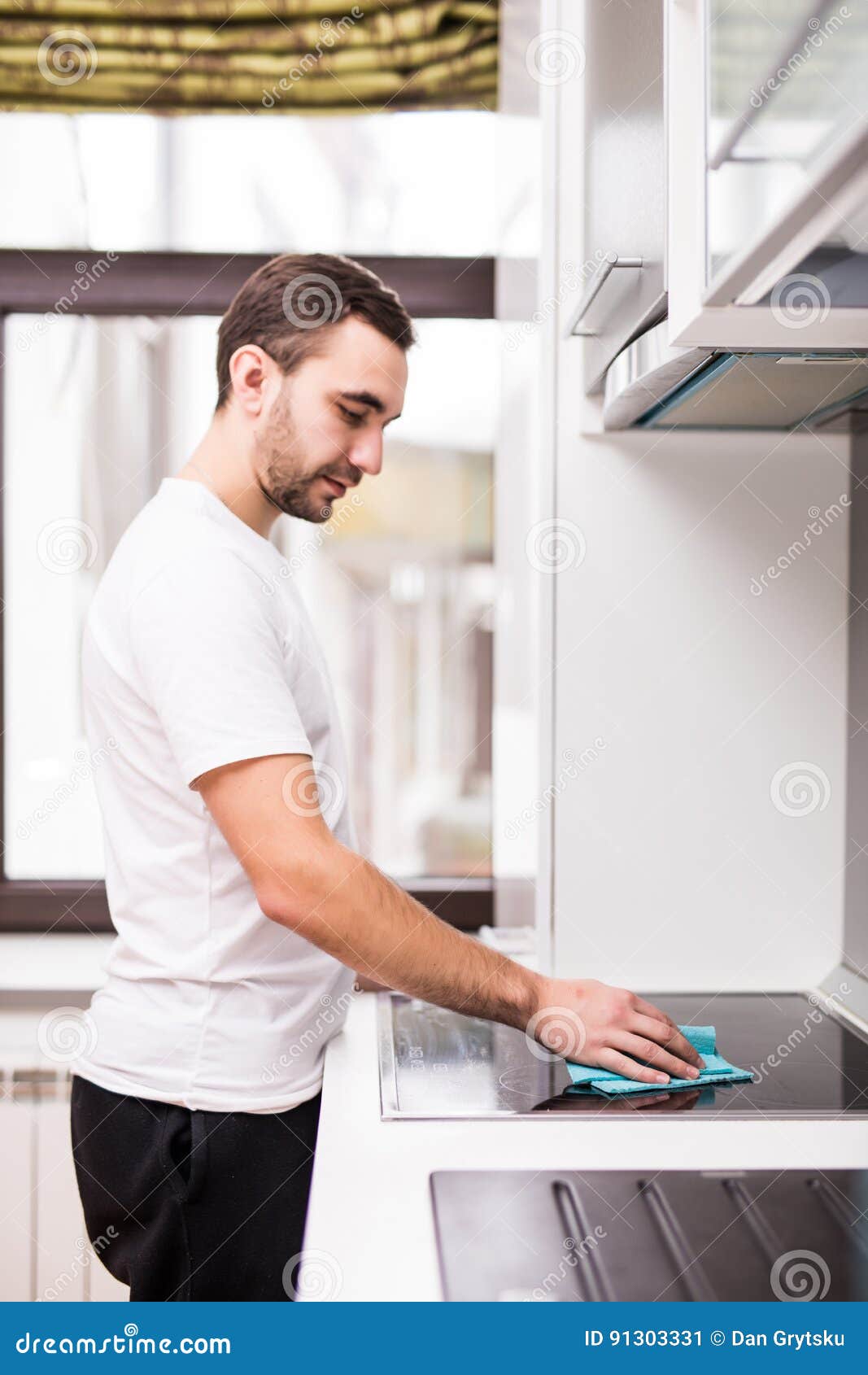Portrait of Smiling Young Man Cleaning Kitchen in the House Stock Image ...