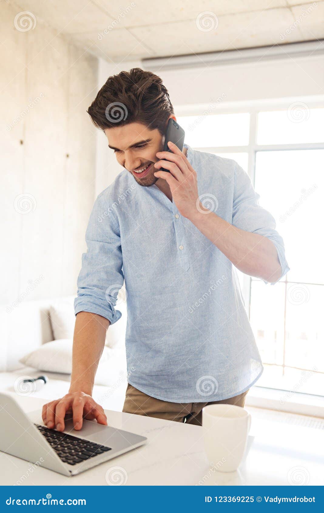 Portrait of a Smiling Young Man Using Laptop Computer Stock Image ...