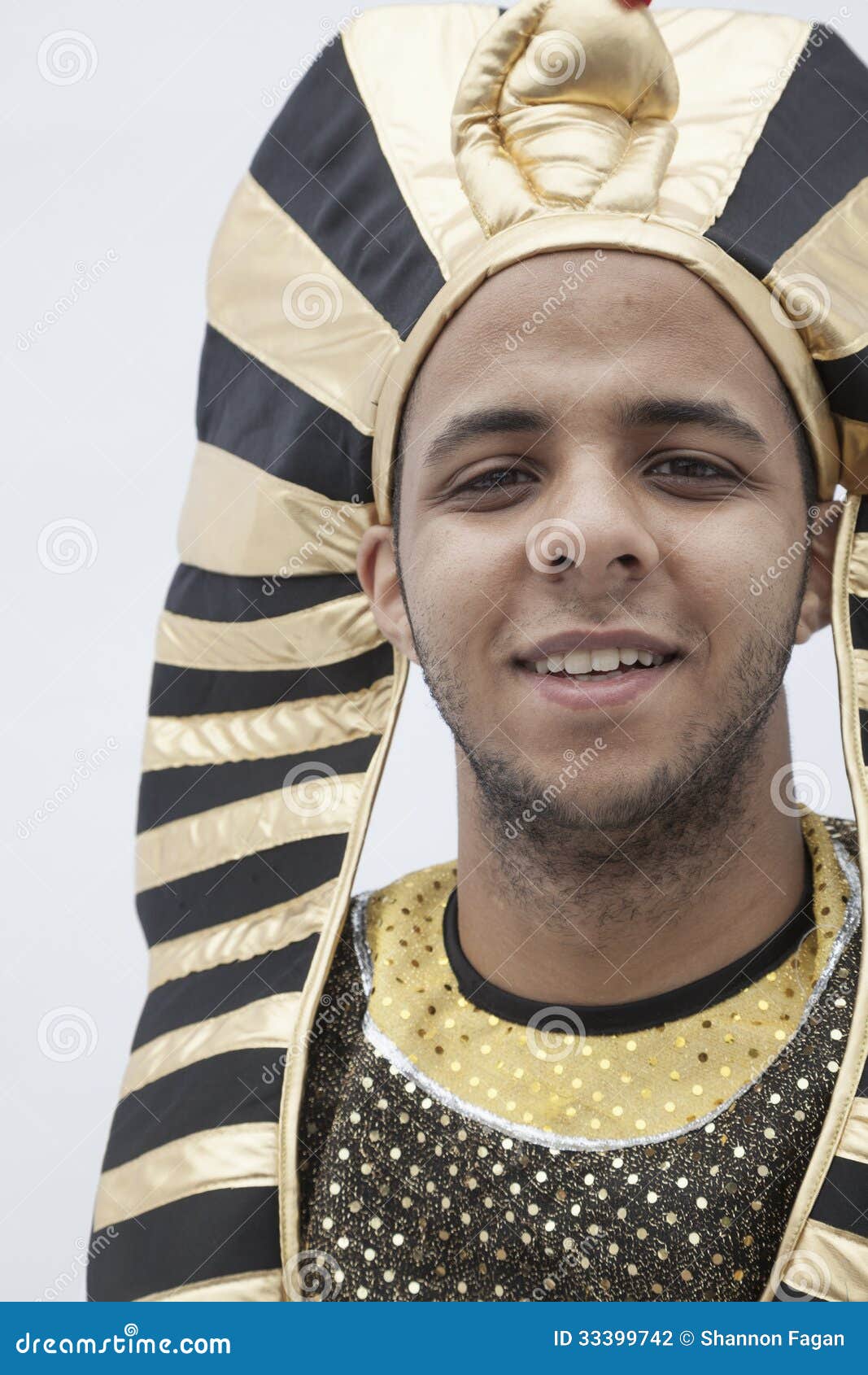 Portrait of Smiling Young Man Wearing a Headdress from Ancient Egypt ... Portrait of Smiling Young Man Wearing a Headdress from Ancient Egypt ...