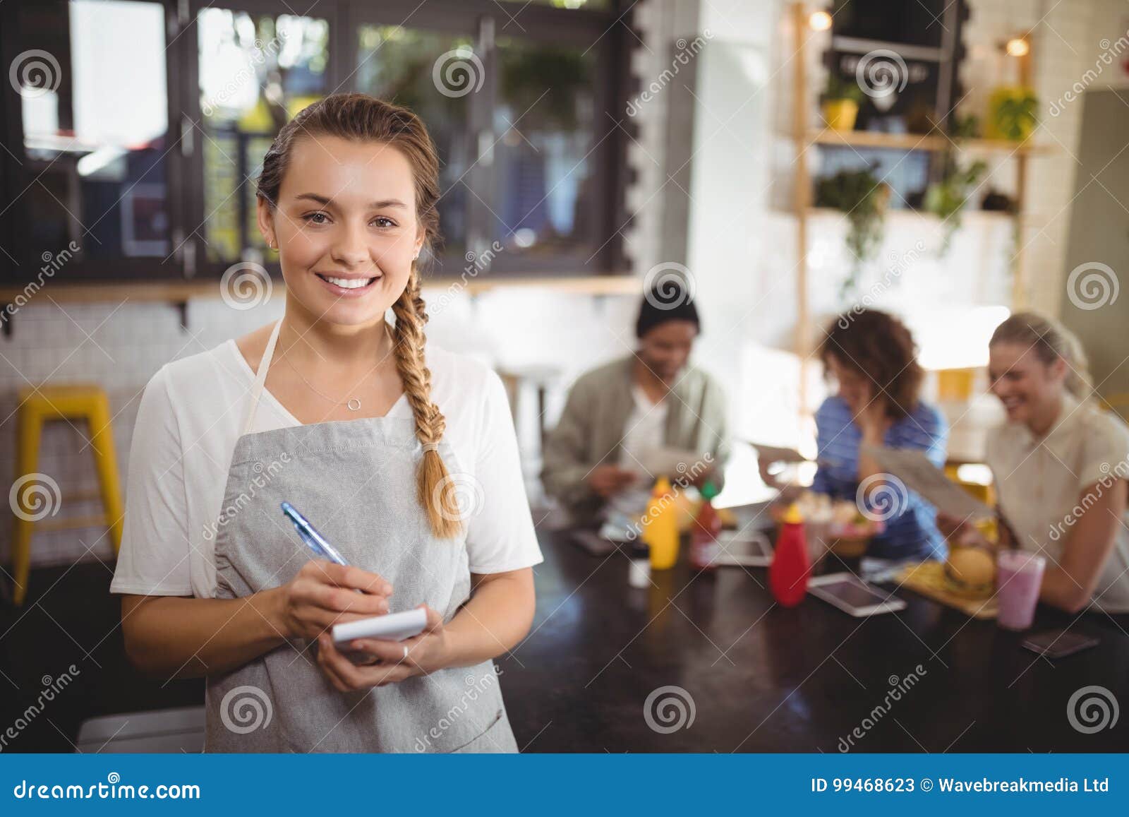 Portrait of Smiling Young Waitress with Notepad at Cafe Stock Image ...