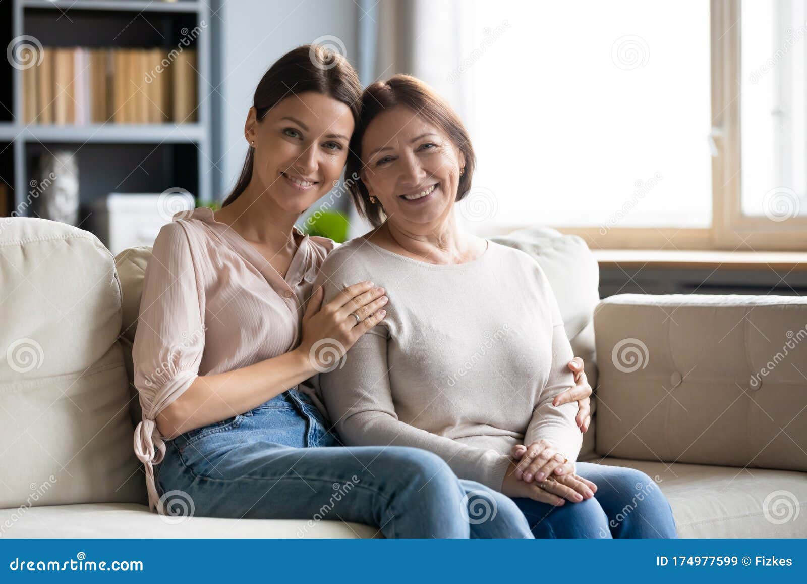 Portrait of Smiling Young Woman Cuddling Older Mother. Stock Image ... Portrait of Smiling Young Woman Cuddling Older Mother. Stock Image ...