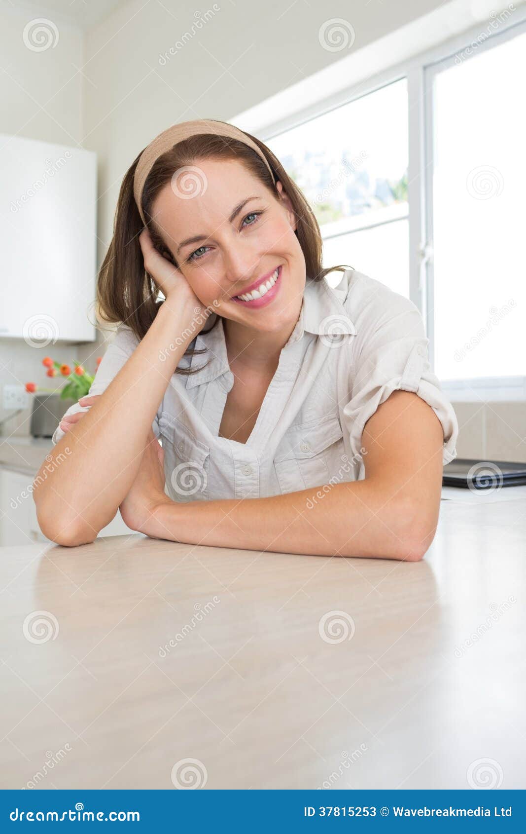 Portrait of a Smiling Young Woman in Kitchen Stock Image - Image of ...