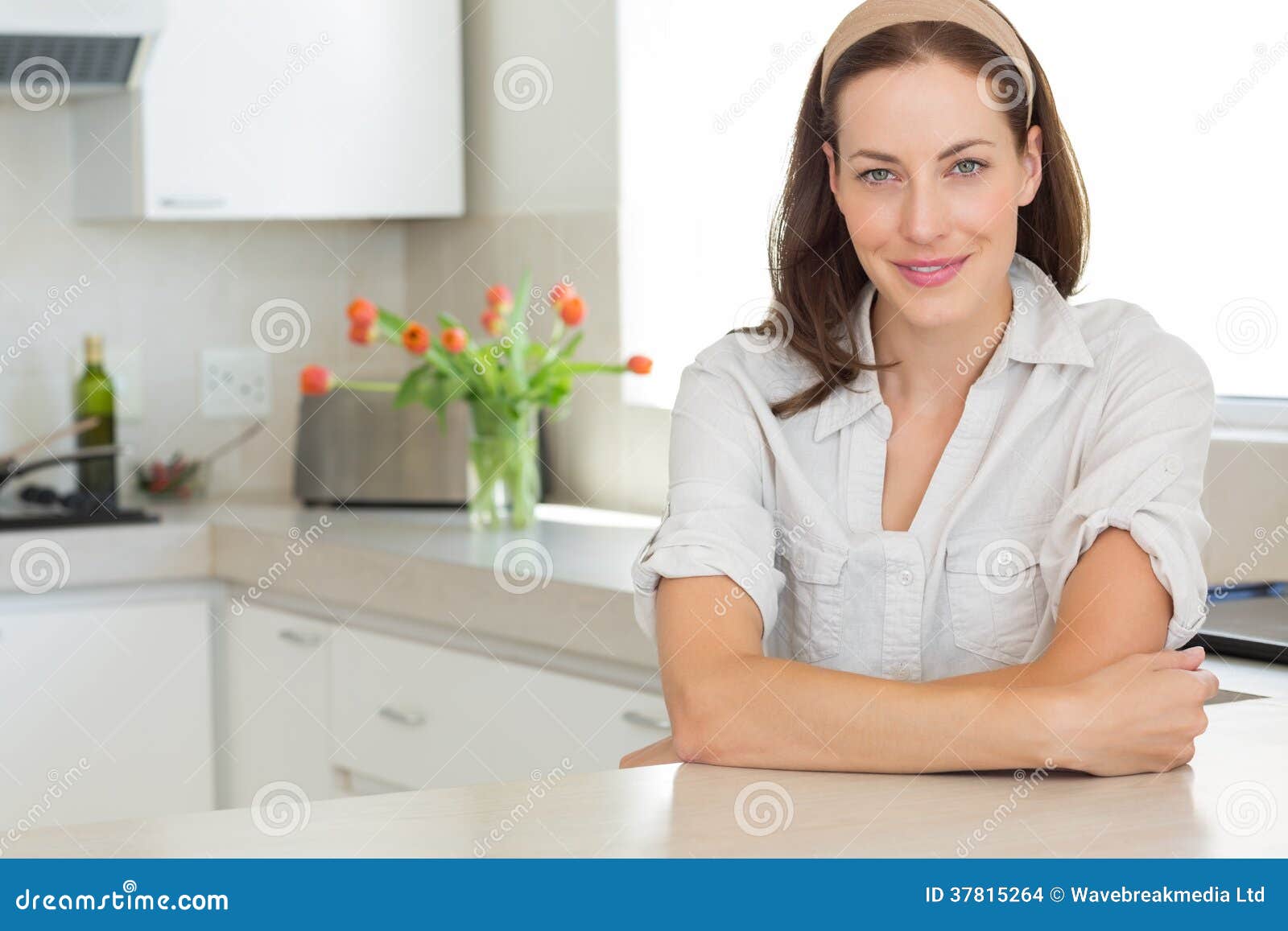 Portrait of a Smiling Young Woman in Kitchen Stock Photo - Image of ...