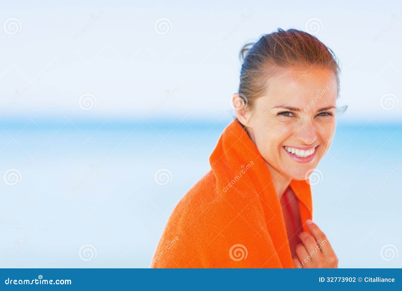 Portrait of Smiling Young Woman Wrapped in Towel on Beach Stock Photo ... Portrait of Smiling Young Woman Wrapped in Towel on Beach Stock Photo ...