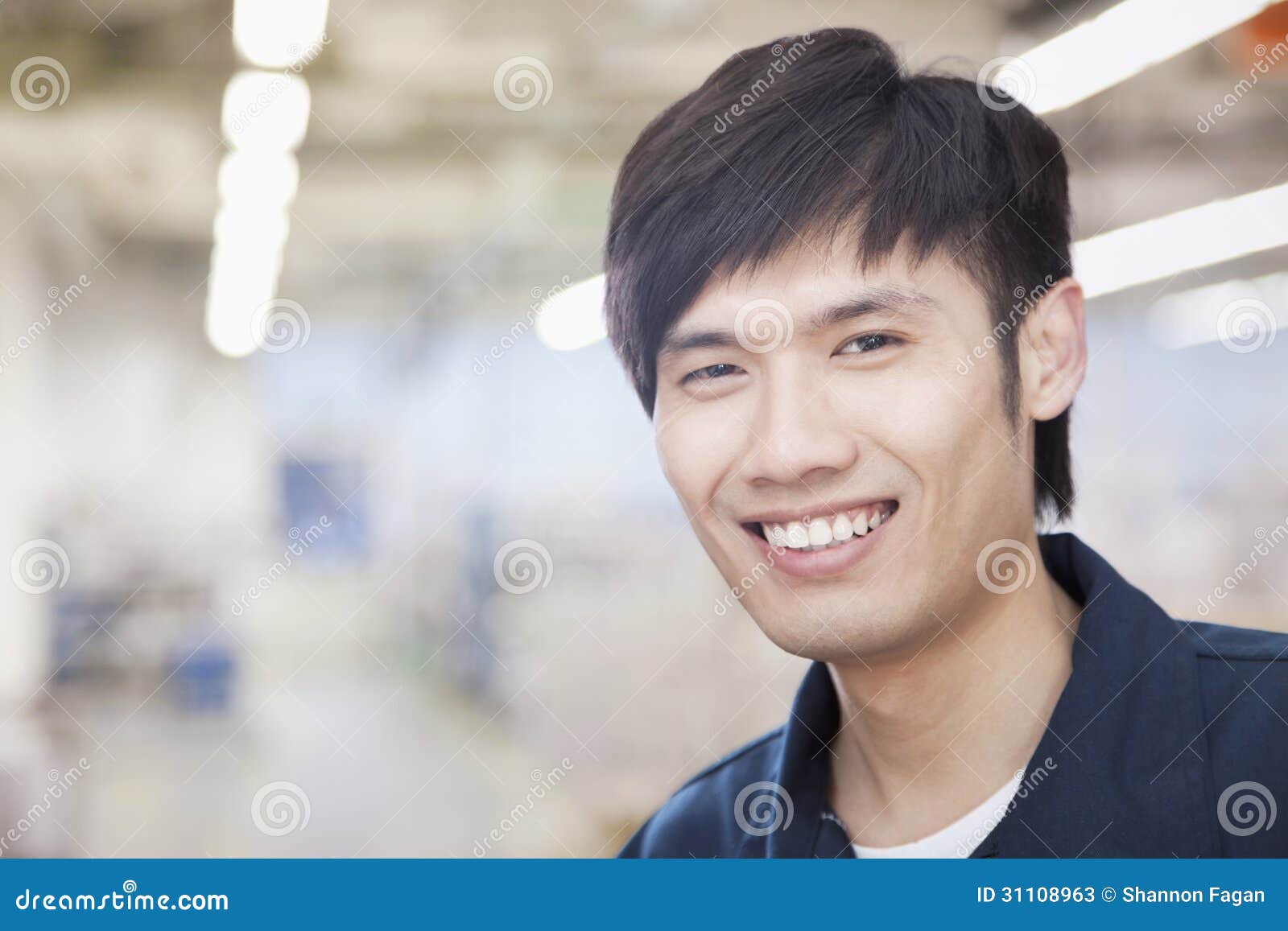 Portrait of Smiling Young Worker at Work Stock Image - Image of smile ...