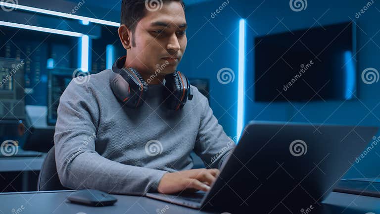 Portrait of Software Developer / Hacker / Programmer Sitting at His ...