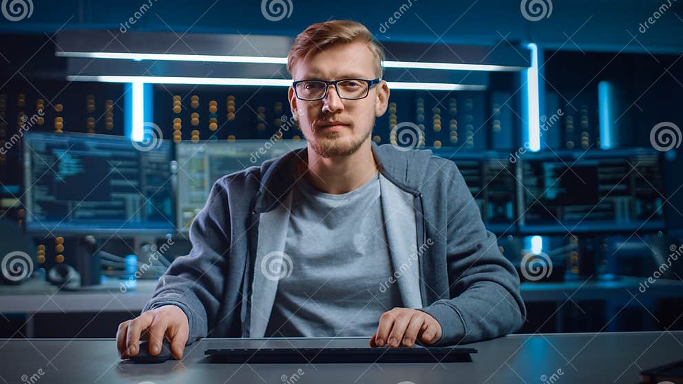 Portrait of Software Developer / Hacker Wearing Glasses Sitting at His ...