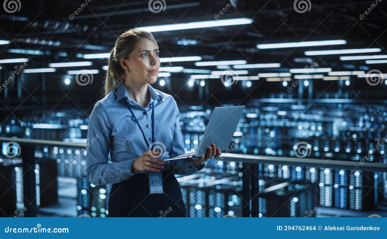 Portrait of it Specialist Using Laptop in Data Center. Big Server Farm ...