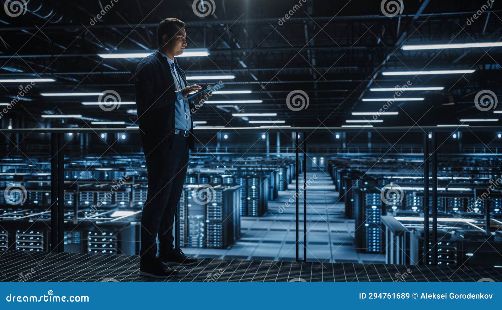 Portrait of it Specialist Using Tablet Computer in Data Center. Big Server Farm Cloud Computing ...