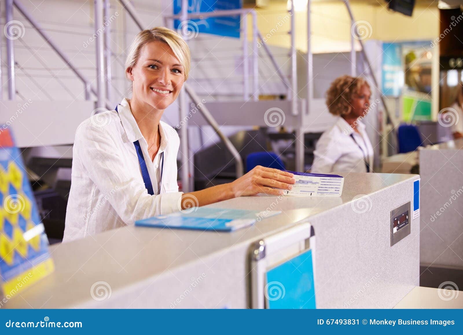 Portrait of Staff at Airport Check in Desk Stock Image - Image of ...
