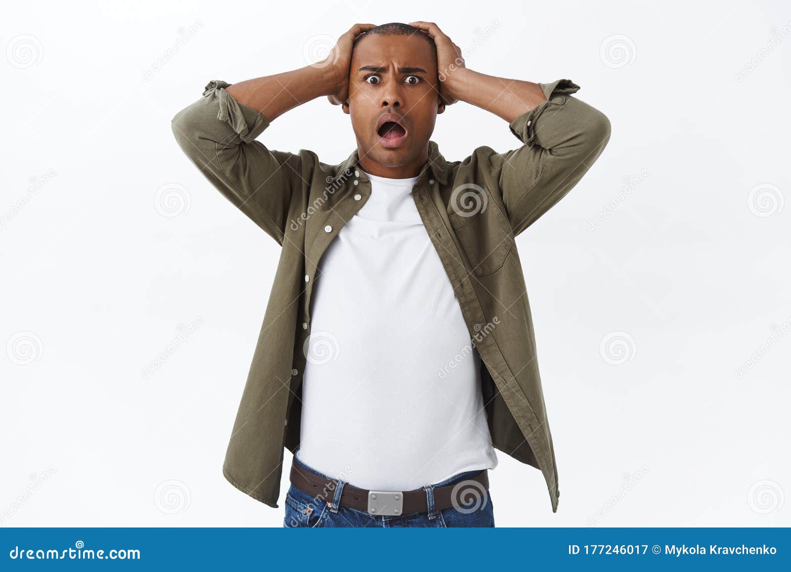 Portrait Of Startled Shocked And Frustrated Panicking Young Man Drop