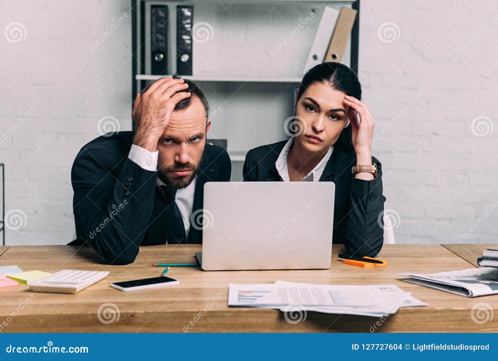 Portrait of Stressed Business People at Workplace with Documents and ...