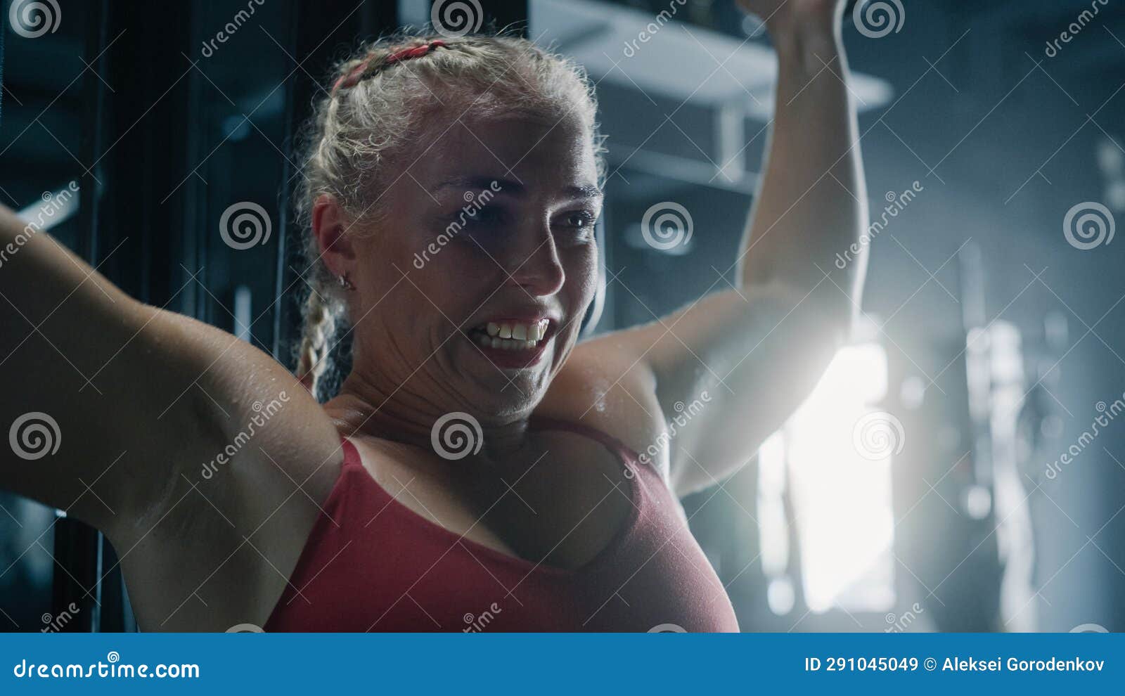 Portrait of a Strong Determined Woman Doing a Strength Exercise Using ...