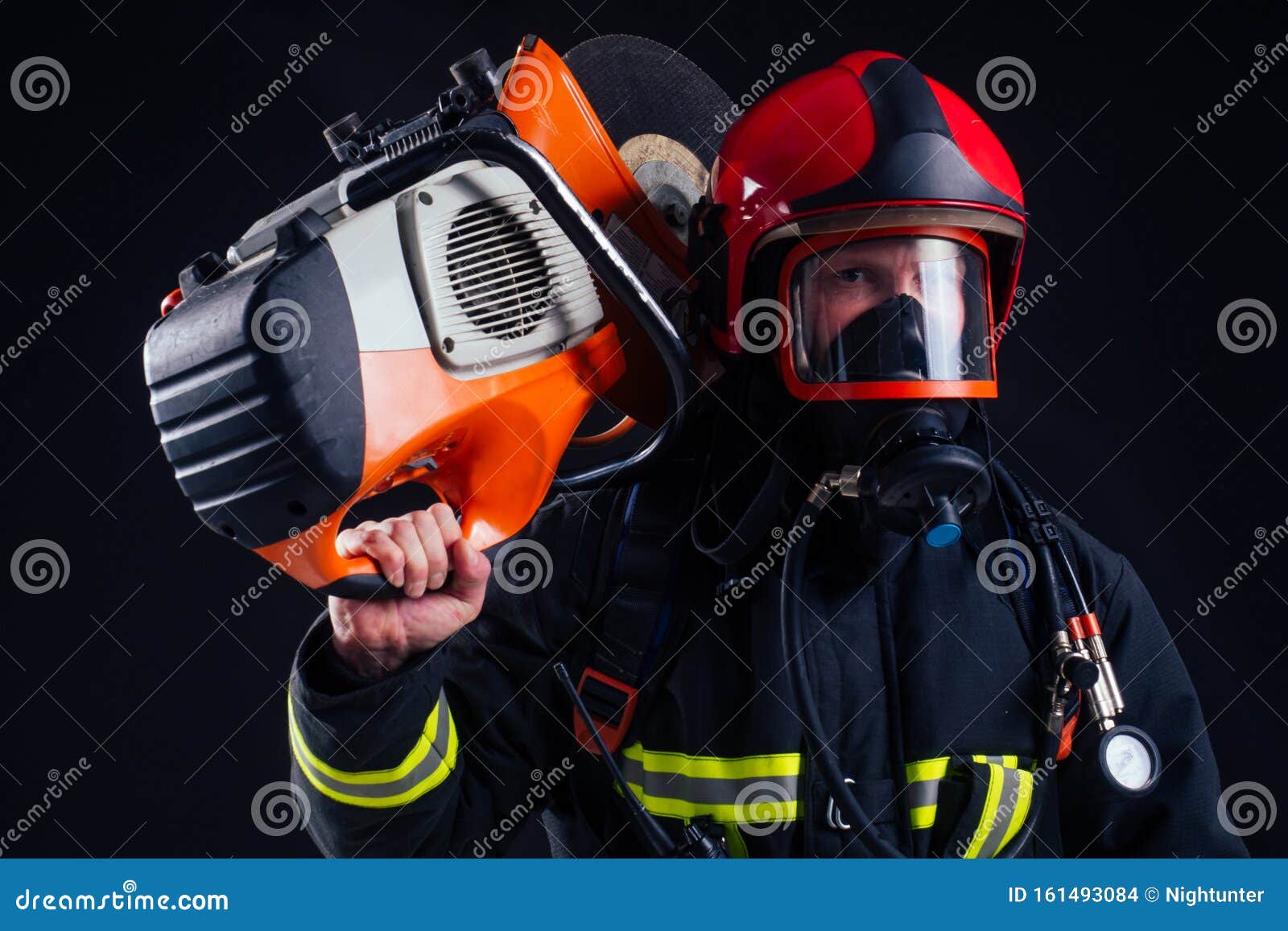 Portrait Strong Fireman in Fireproof Uniform Holding an Ax Chainsaw in ...