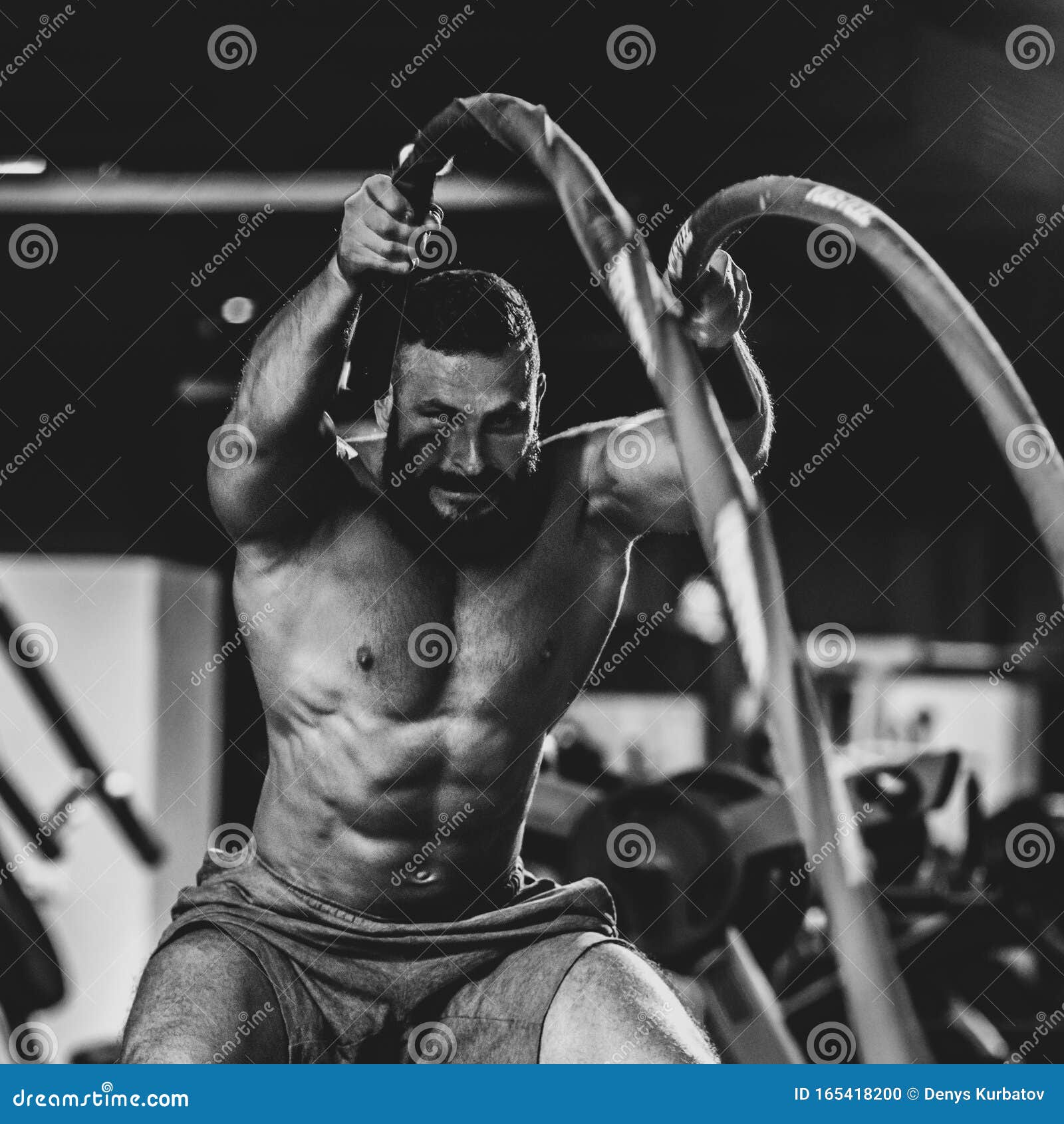 Bodybuilder pulling rope stock photo. Image of exercise - 165418200