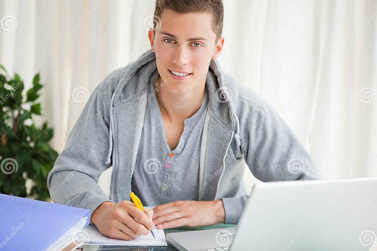 Portrait of a Student Doing His Homework Stock Photo - Image of smiling ...