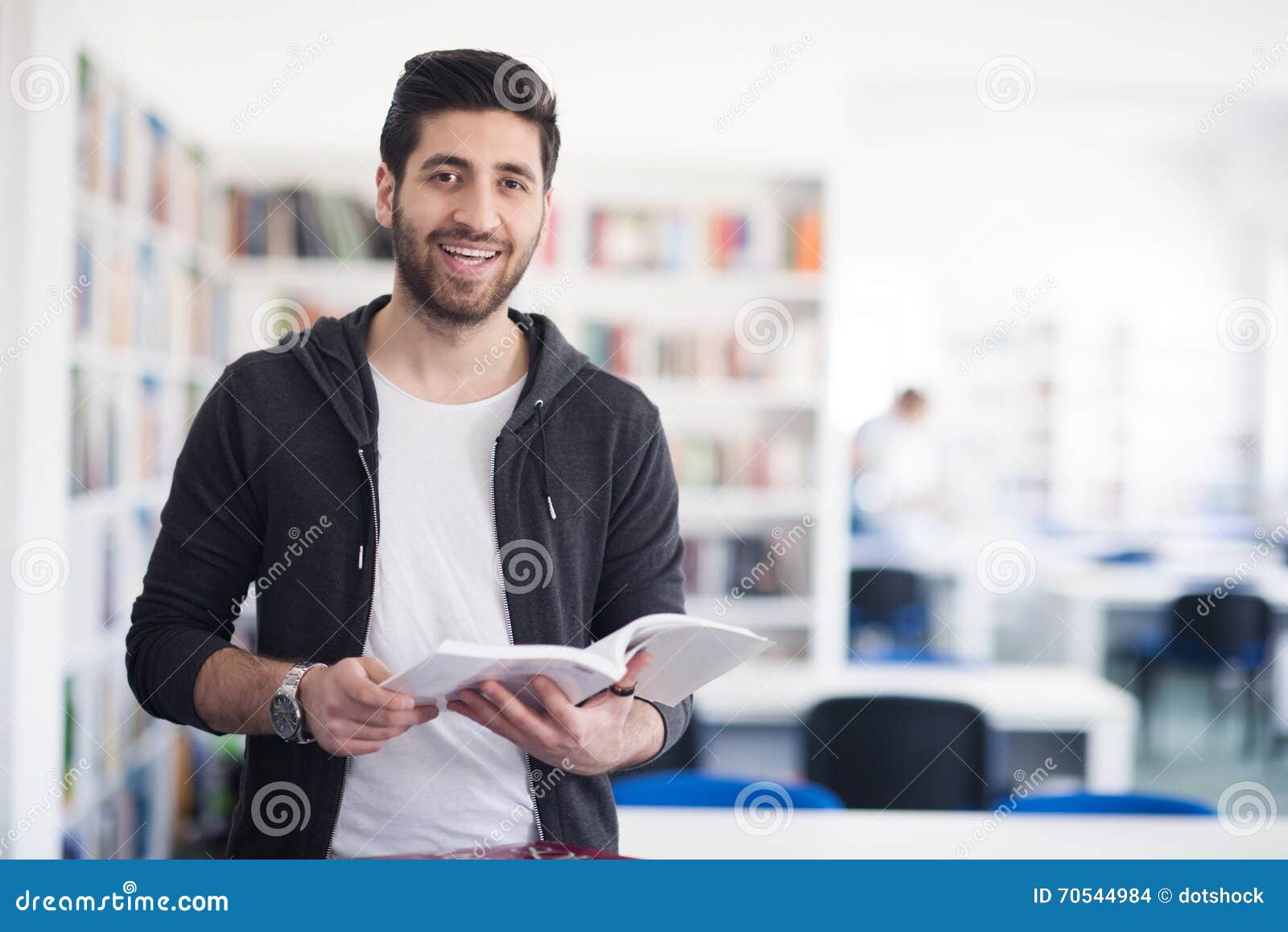 Portrait of Student while Reading Book in School Library Stock Photo ...