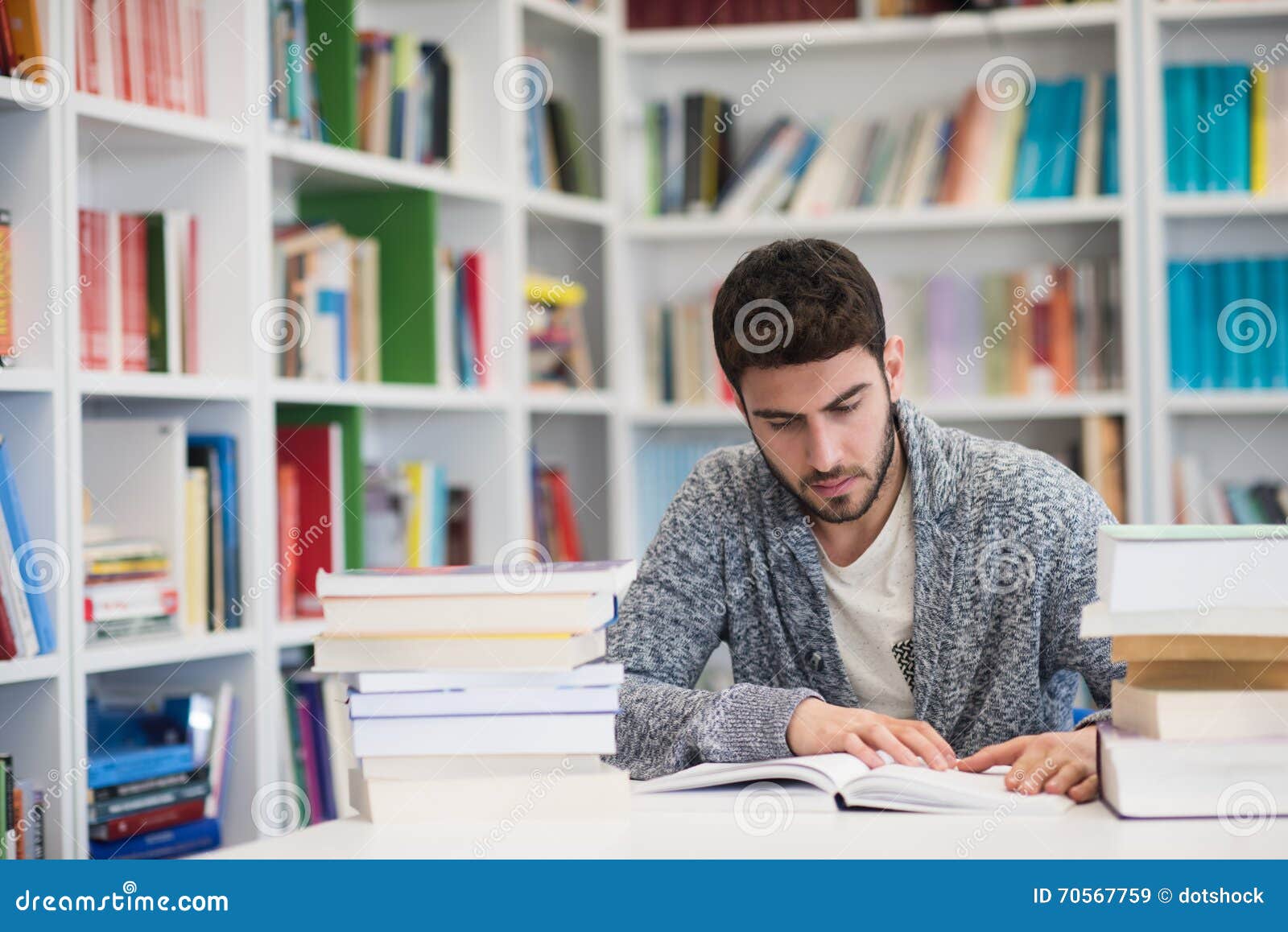 Portrait of Student while Reading Book in School Library Stock Image ...