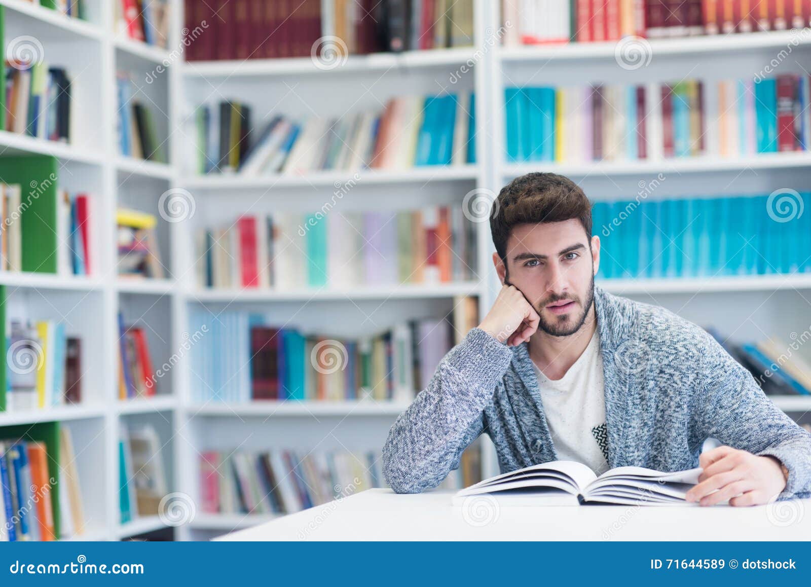 Portrait of Student while Reading Book in School Library Stock Image ...