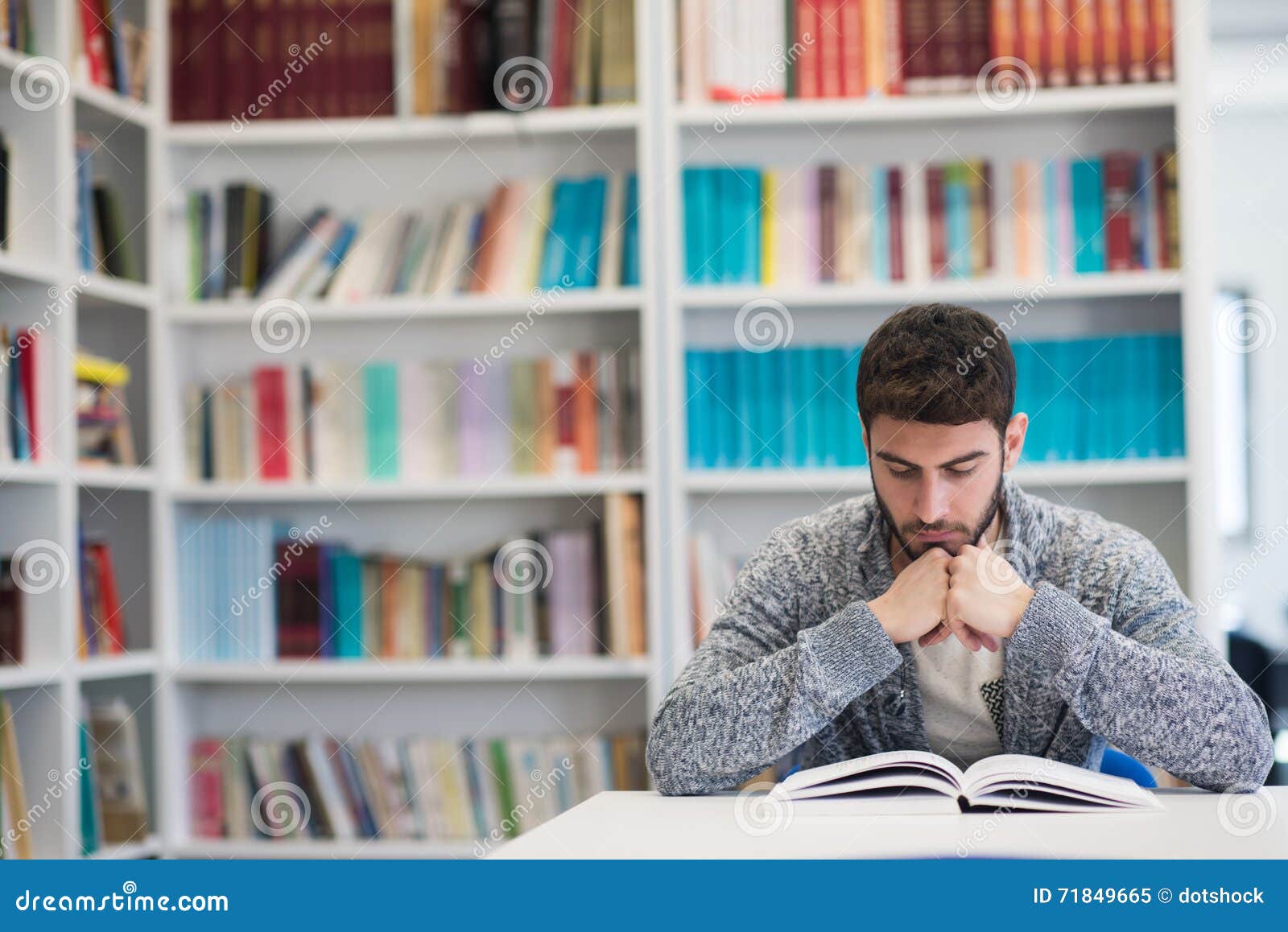 Portrait of Student while Reading Book in School Library Stock Image ...