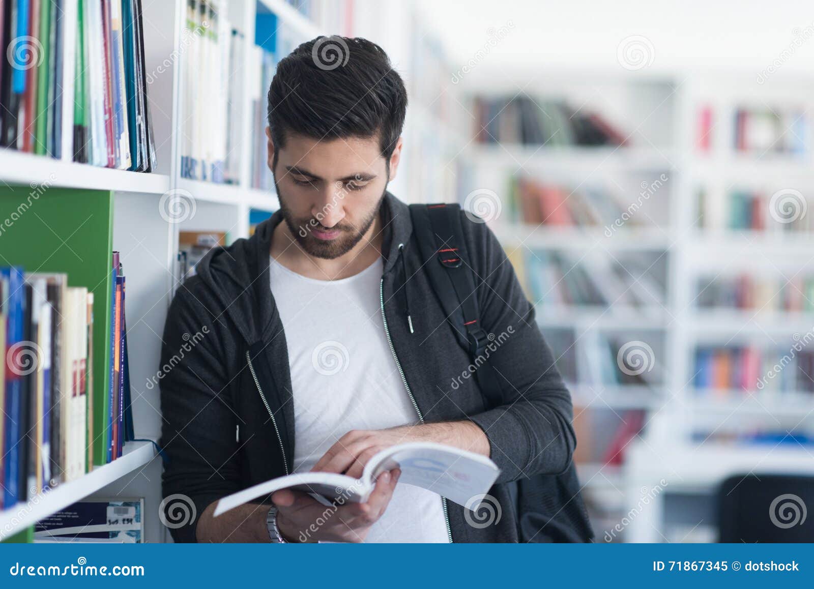 Portrait of Student while Reading Book in School Library Stock Image ...