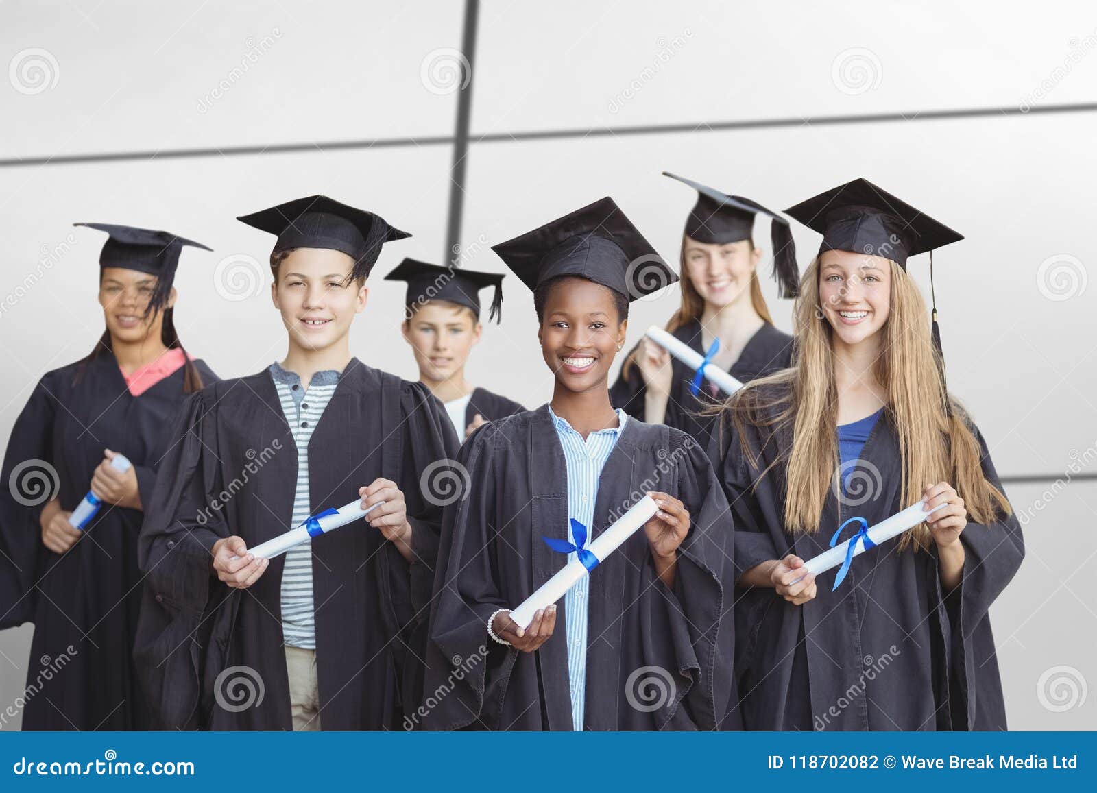 Composite Image of Portrait of Students Holding Degree Stock Photo ...