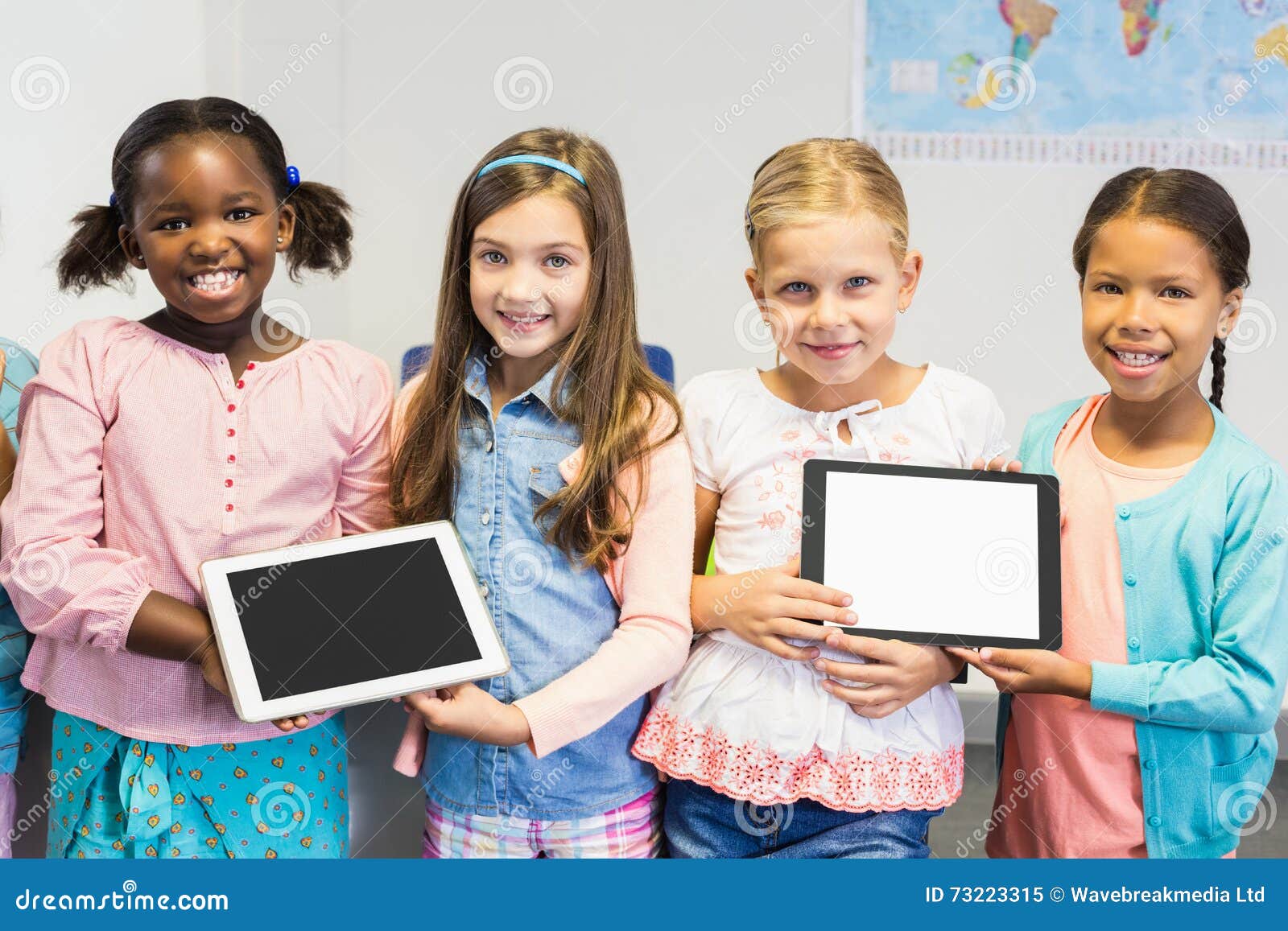 Portrait of Students Holding Digital Tablet in Classroom Stock Image ...