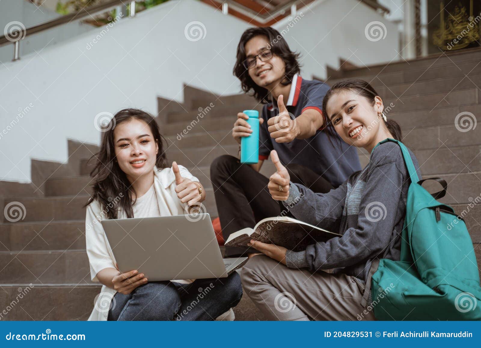 Portrait Students Sit Down Working in Groups on the Floor Stairs Campus ...